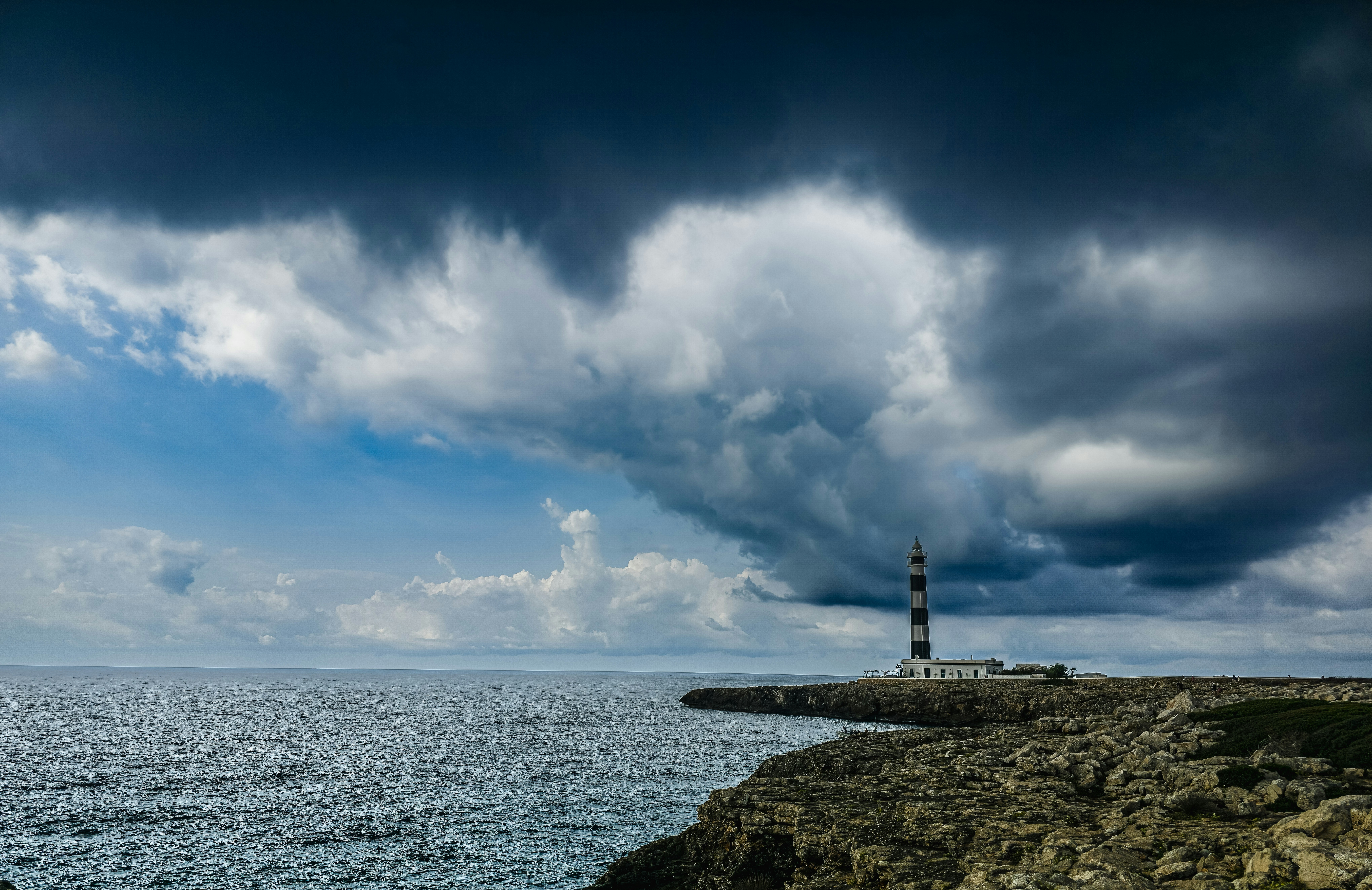 Lighthouse Sentinel Beneath Tempest Skies