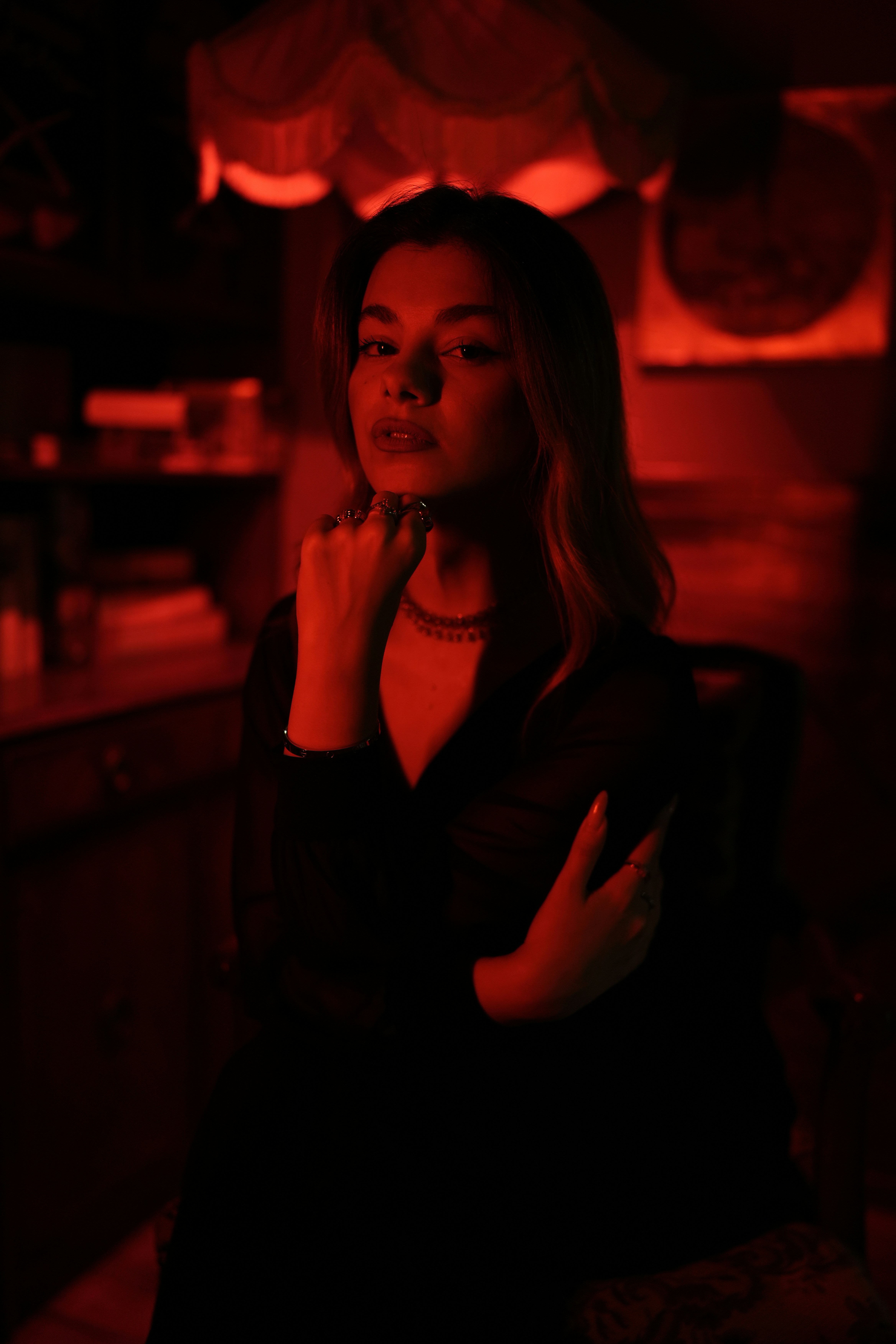 Crimson Quiet: A Portrait in Low Light
