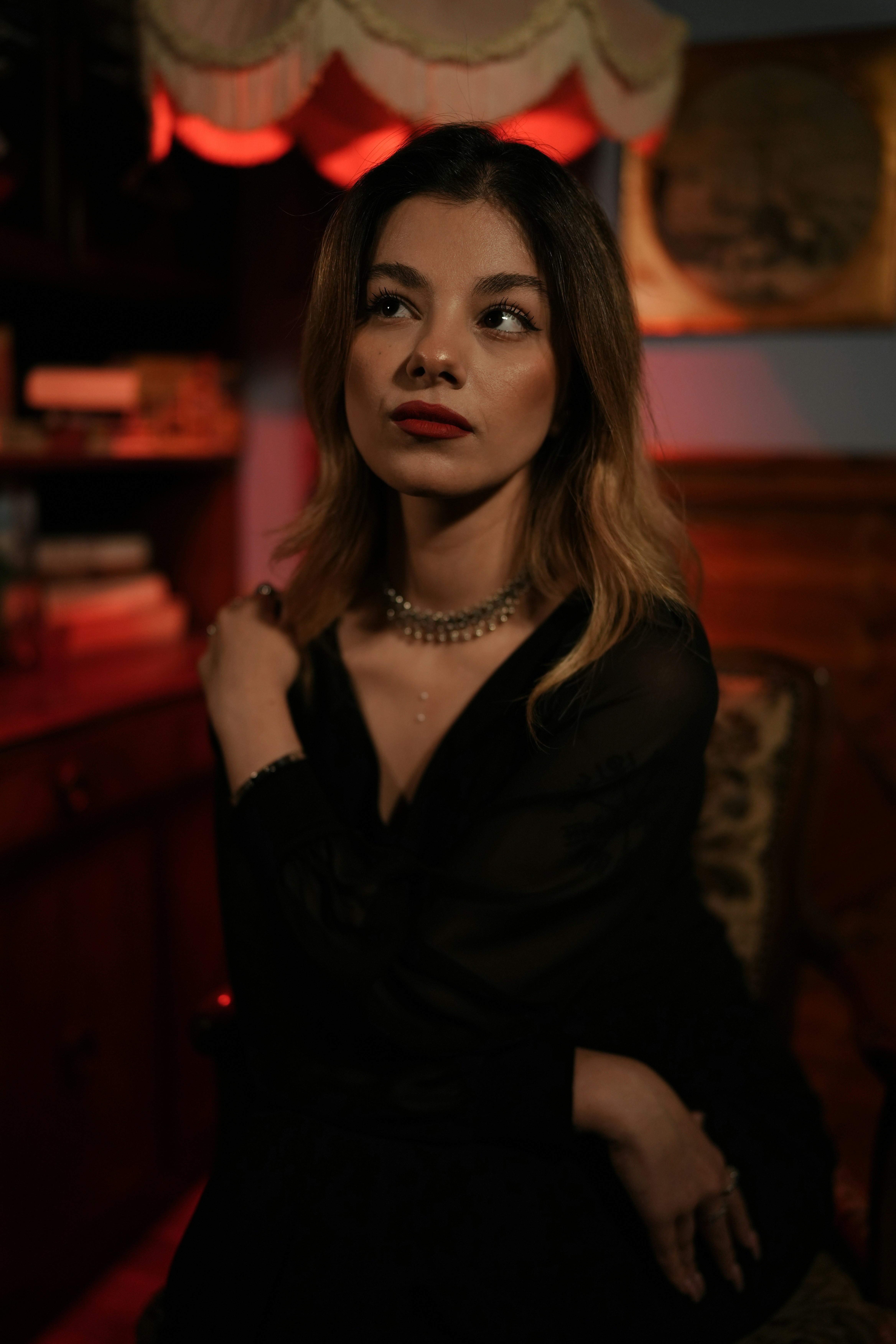Velvet Noir: A Quiet Moment in Warm Red Light