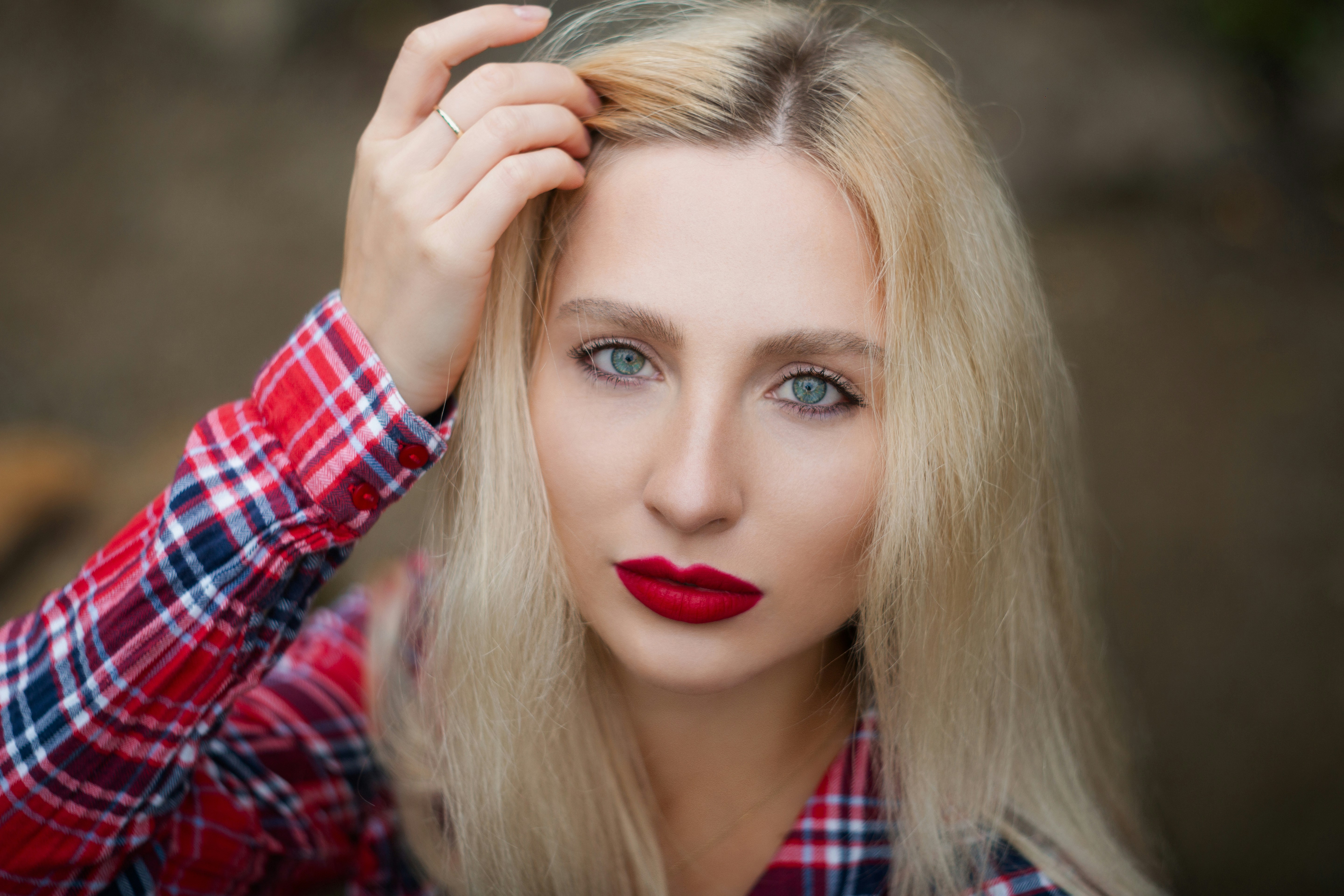 Blonde confidence under a crimson lip