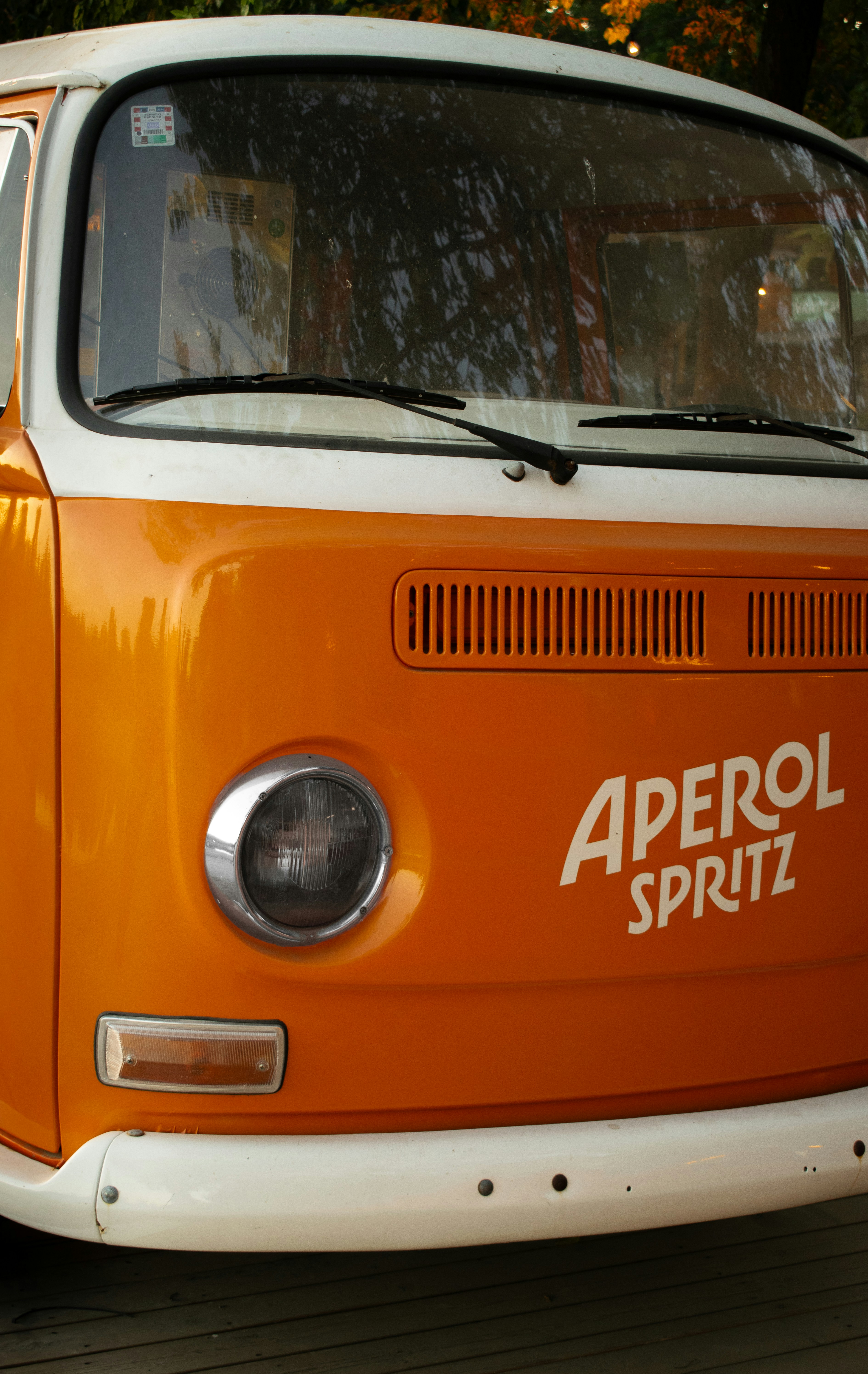 Orange vintage van: bold branding on a retro front panel