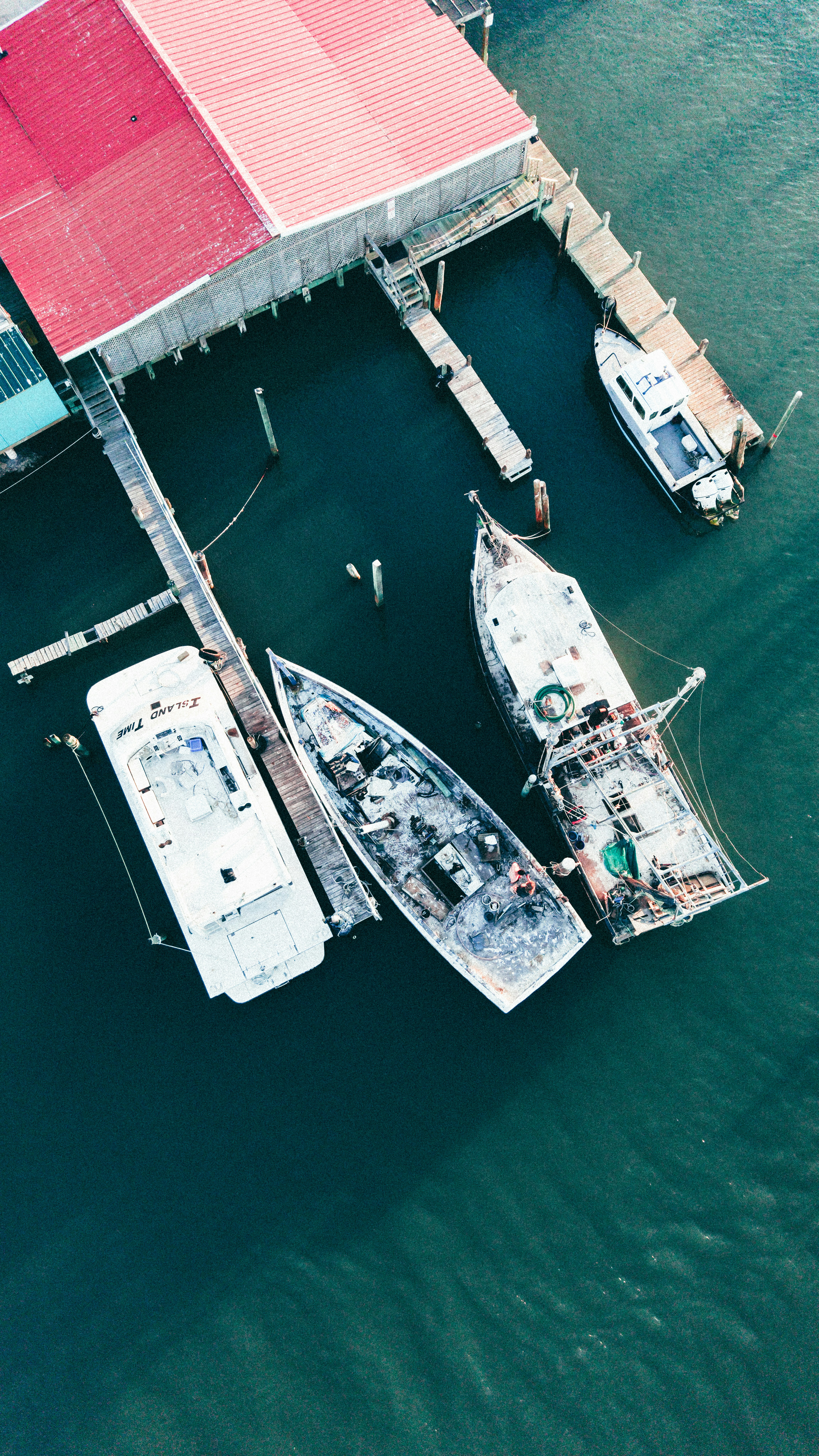Aerial Dockscape: Boats Resting at a Quiet Pier
