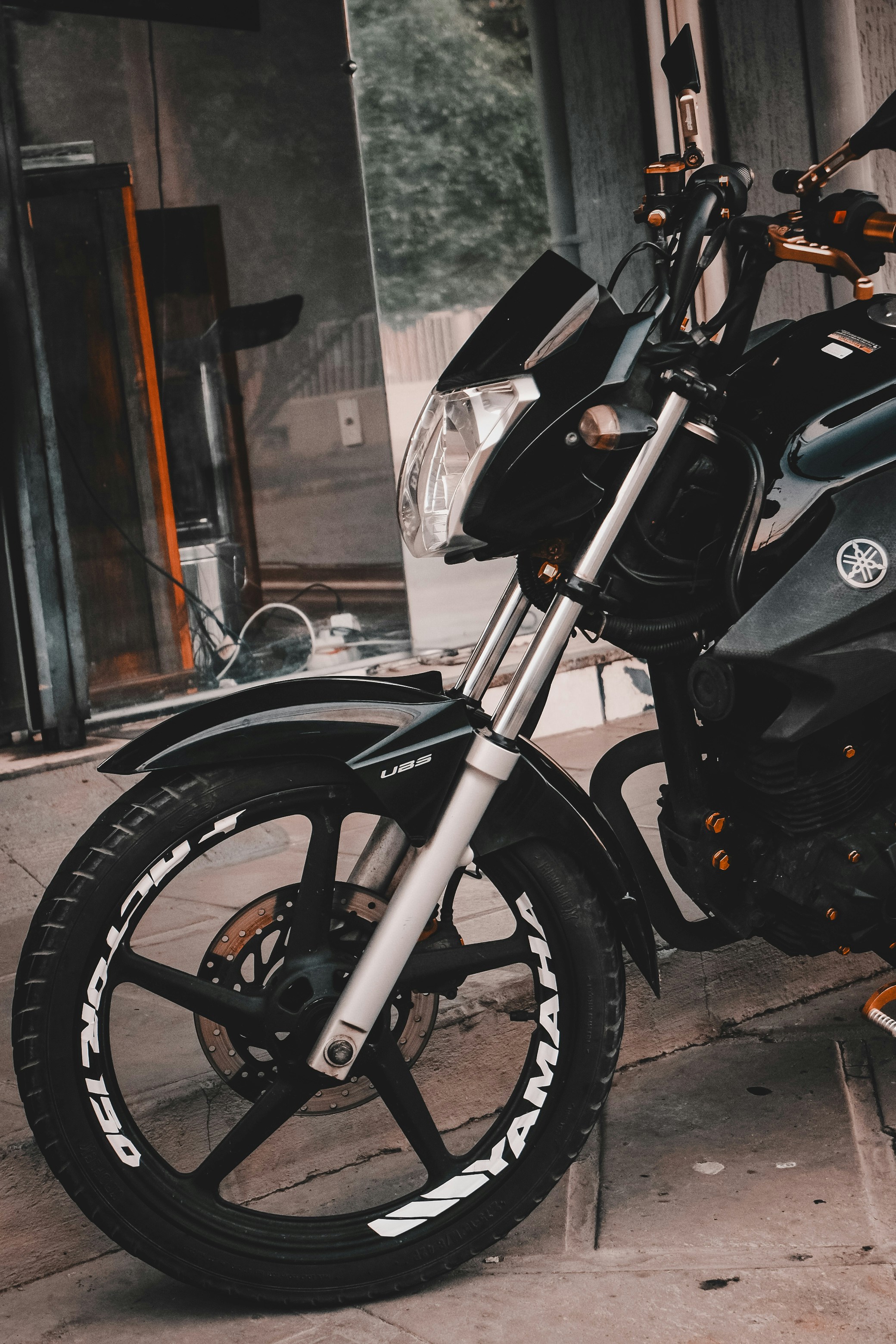 Urban Noir Moto: Front Wheel and Headlight in Focus