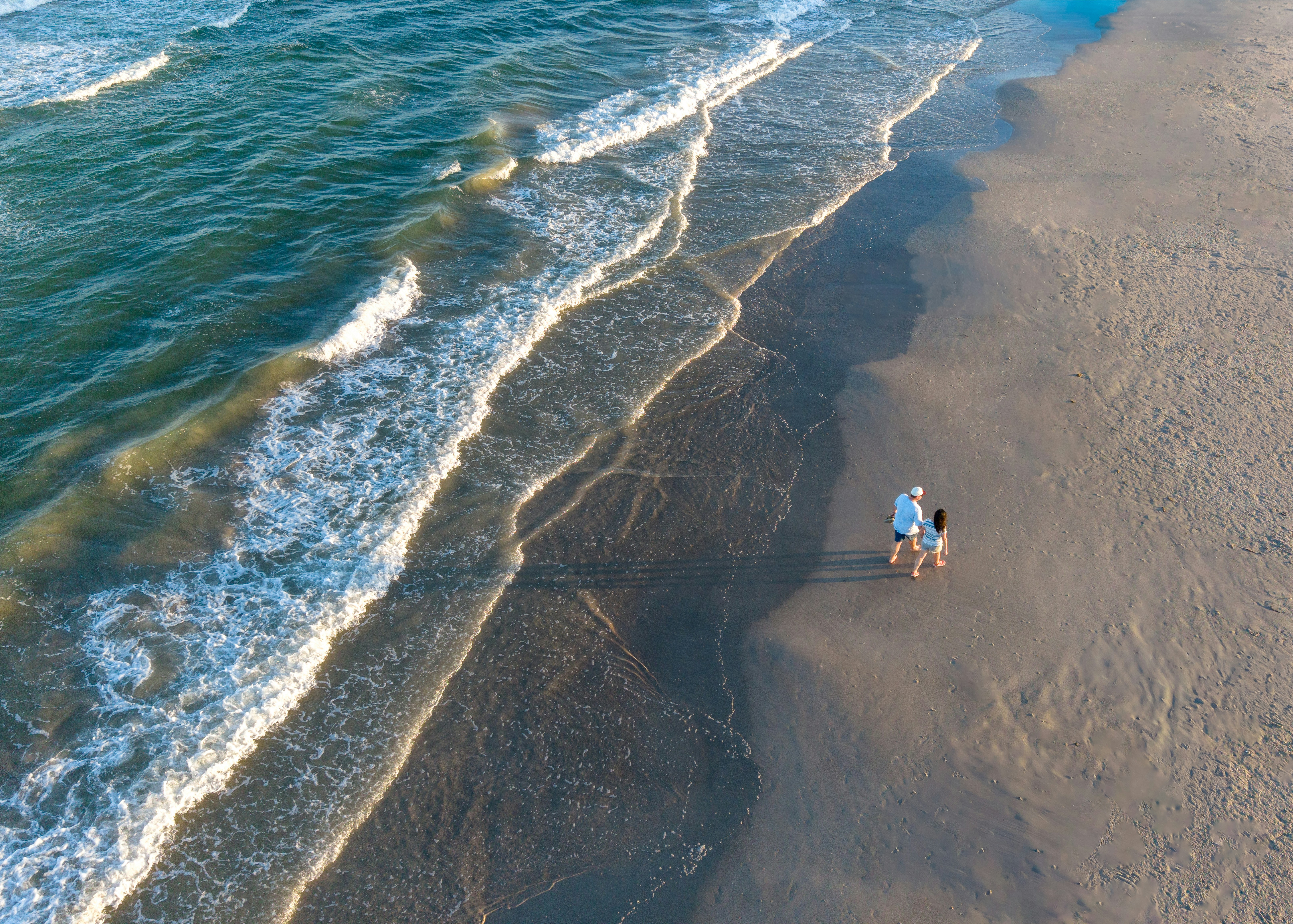Lone Walk by the Tidal Line