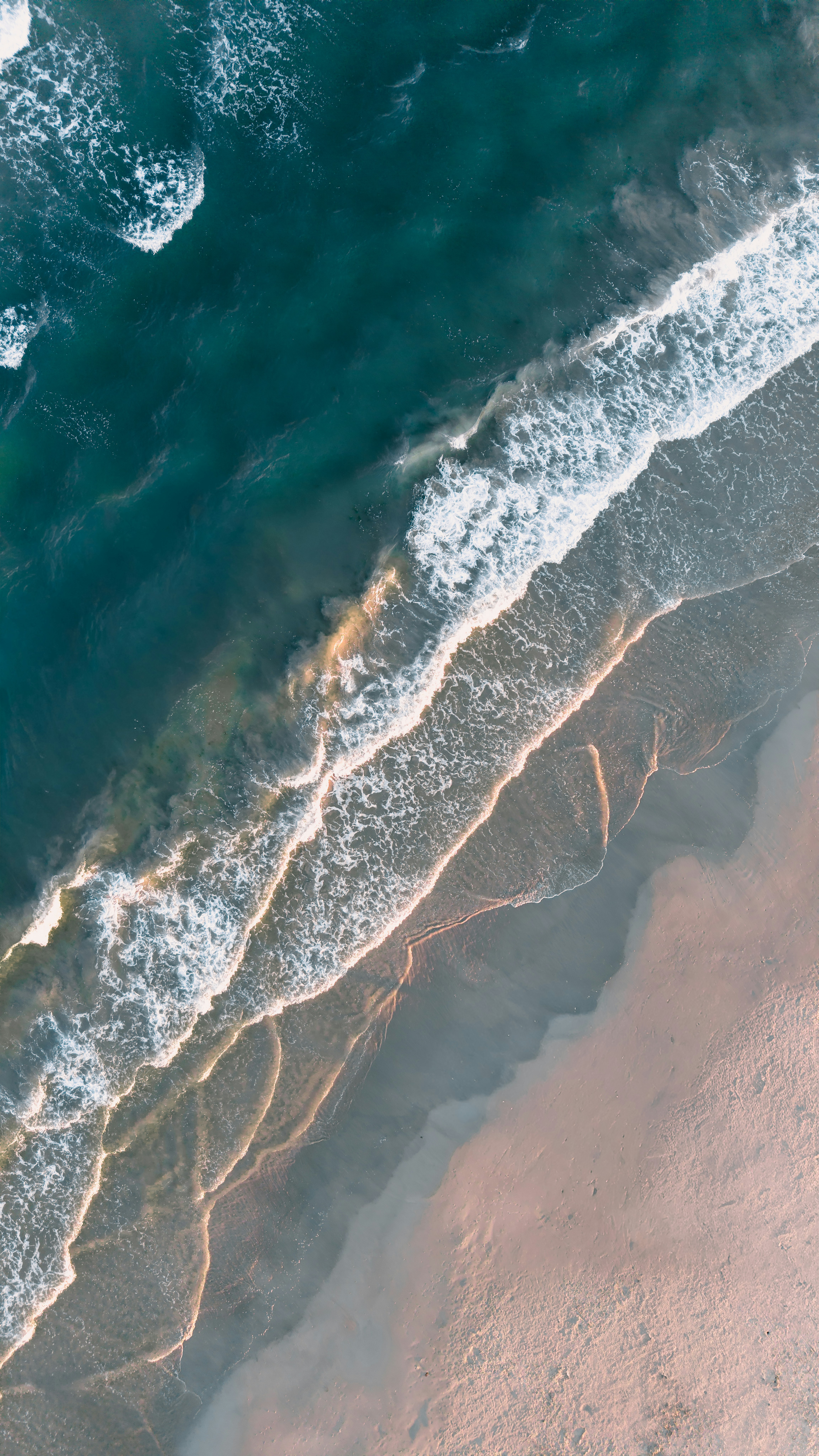 Aerial Whisper: Sand and Sea Meet in a Diagonal Tide
