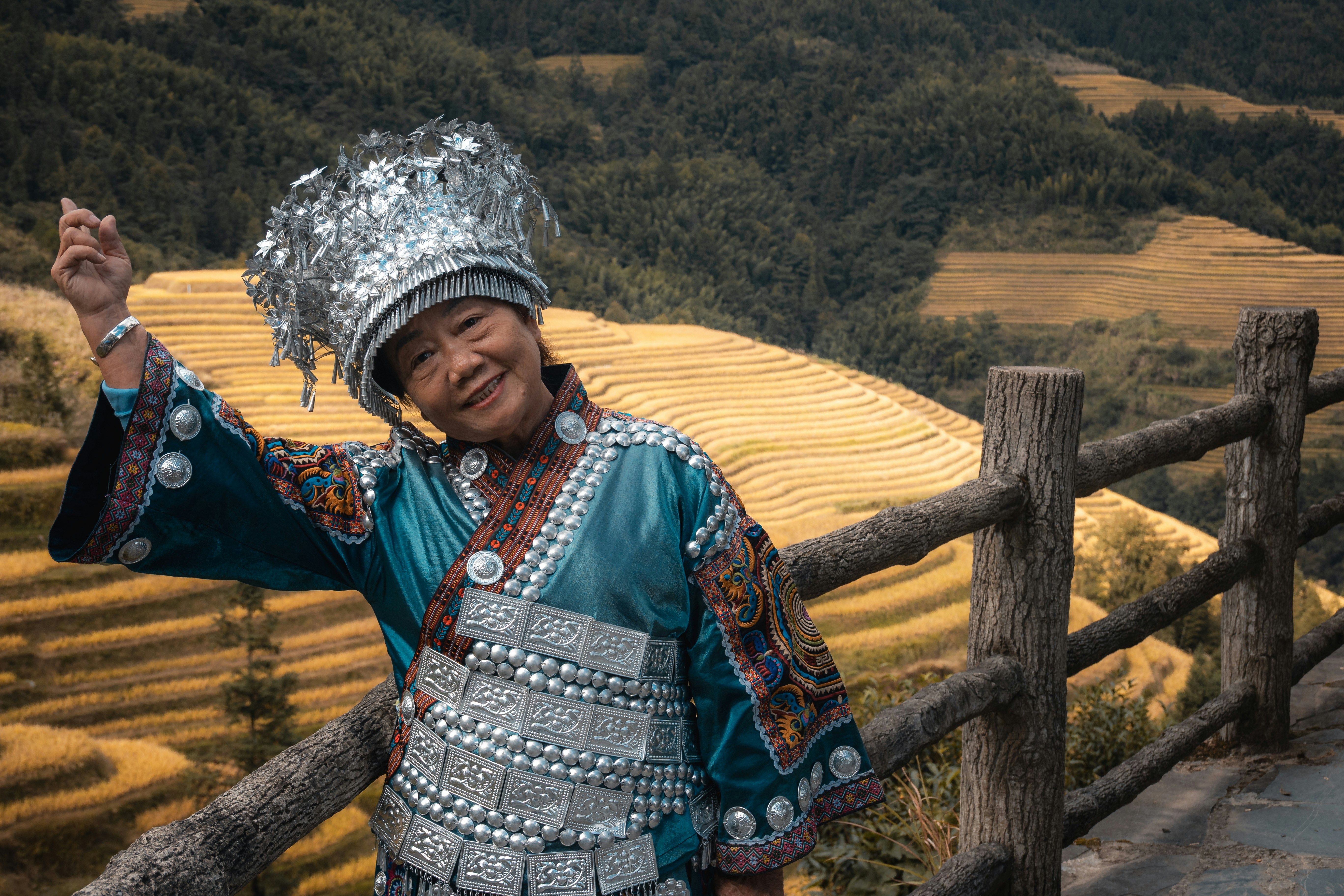 Joyful Dancer in Moonlit Armor Overlooking Terraced Valleys