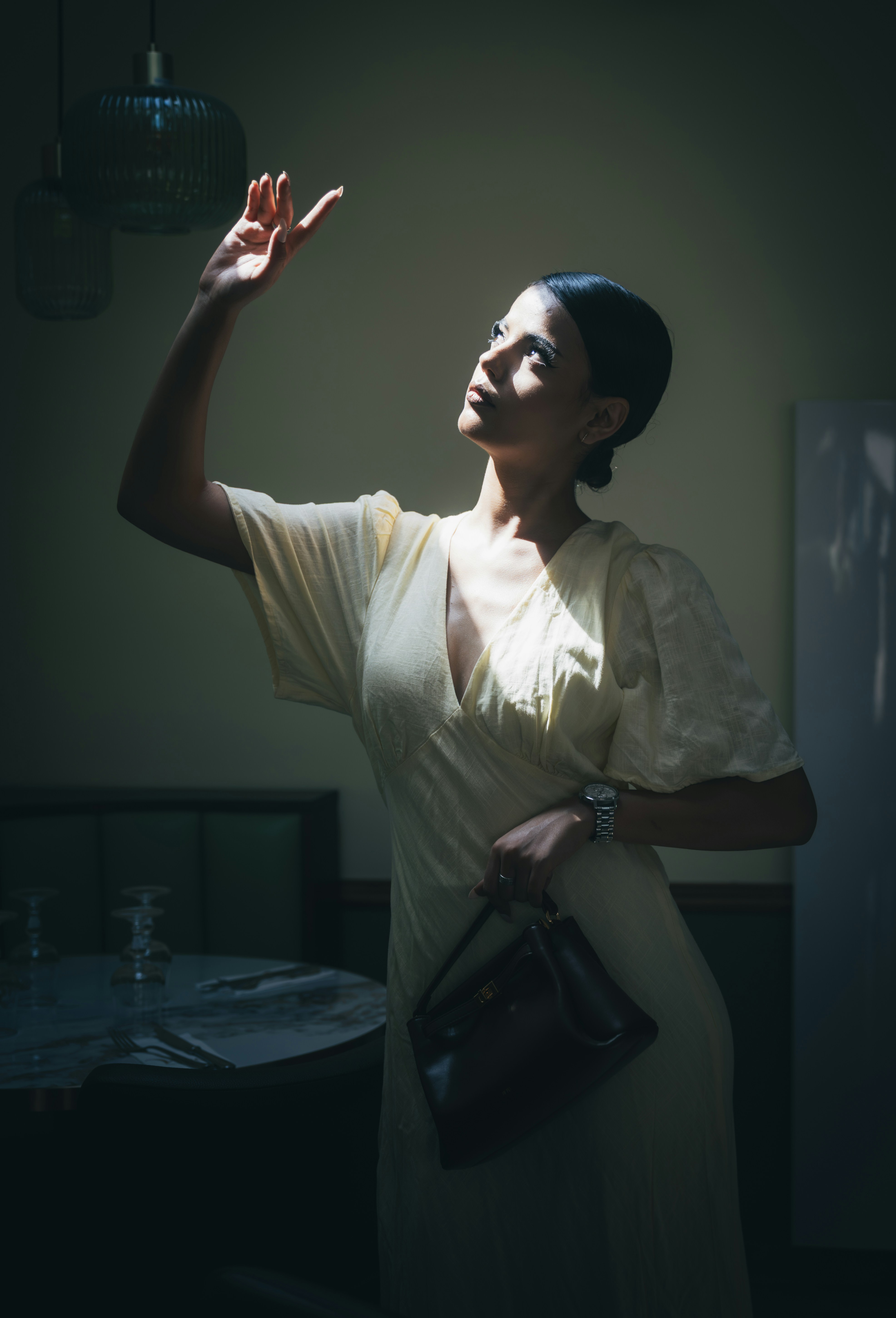 Moonlit Gesture: A Woman Reaches Toward the Lanterns