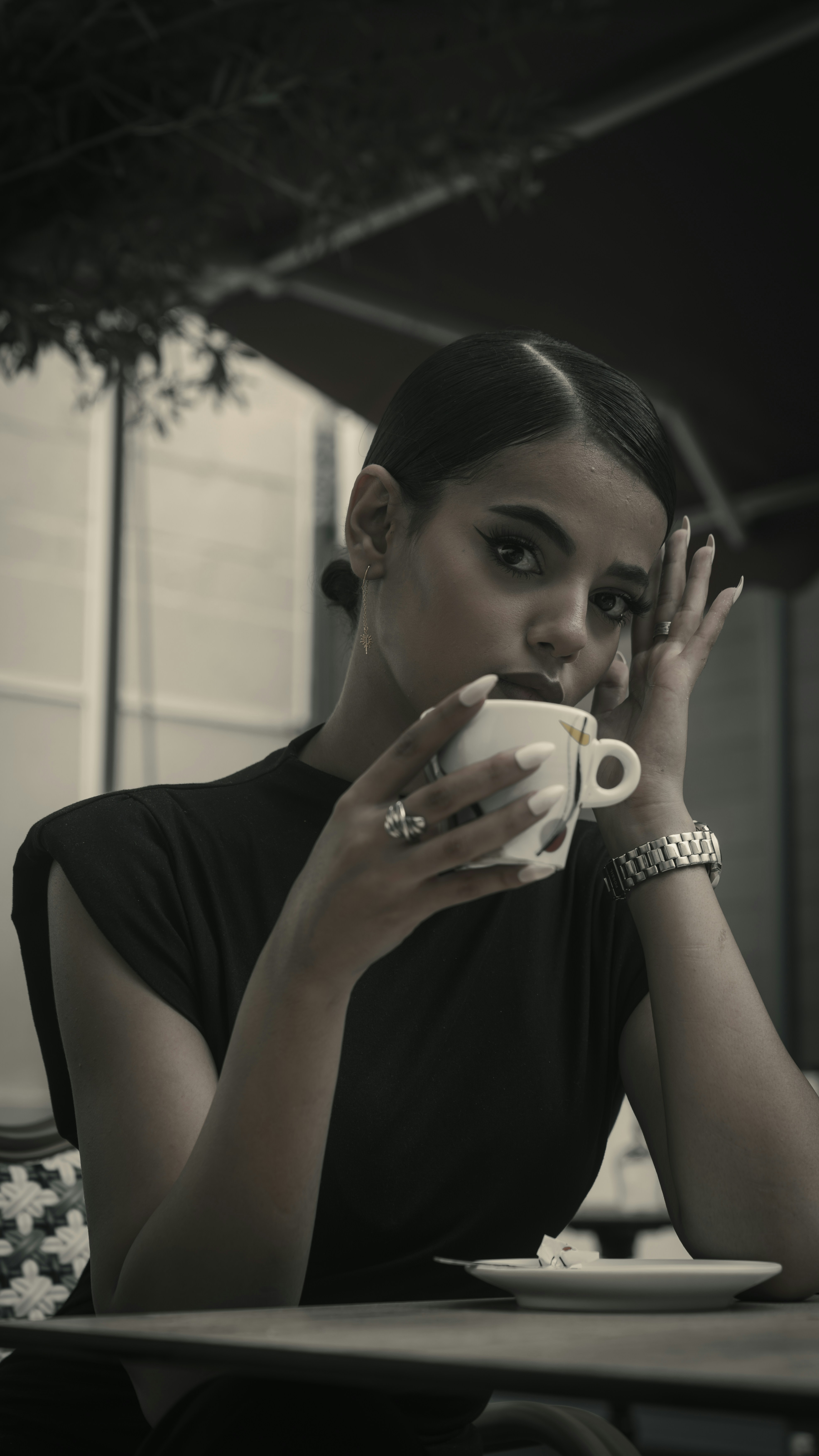 Midday Brew: A Quiet Moment Under The Café Canopy