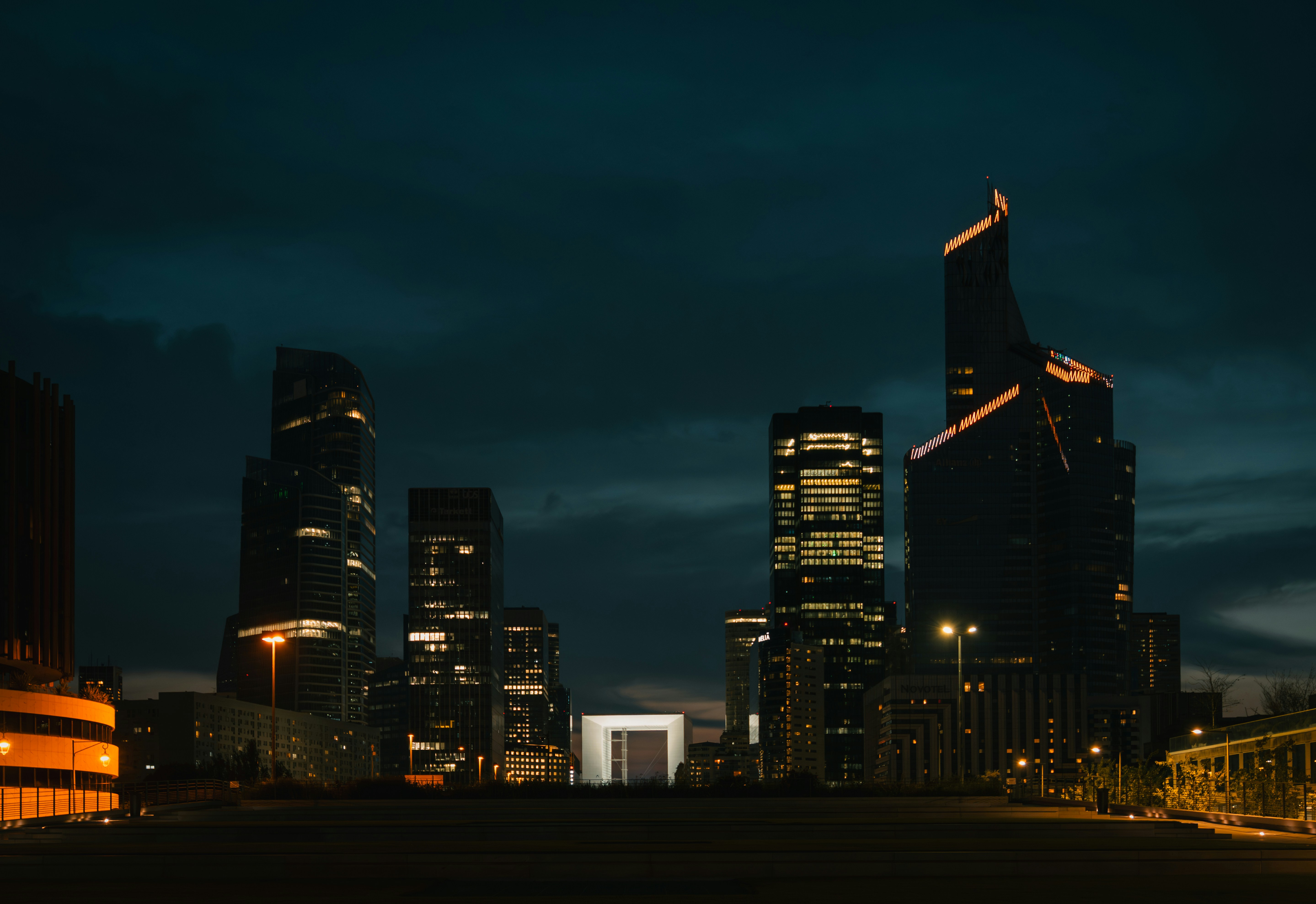 Midnight Grid: Neon Skyscrapers Framing the Empty Plaza