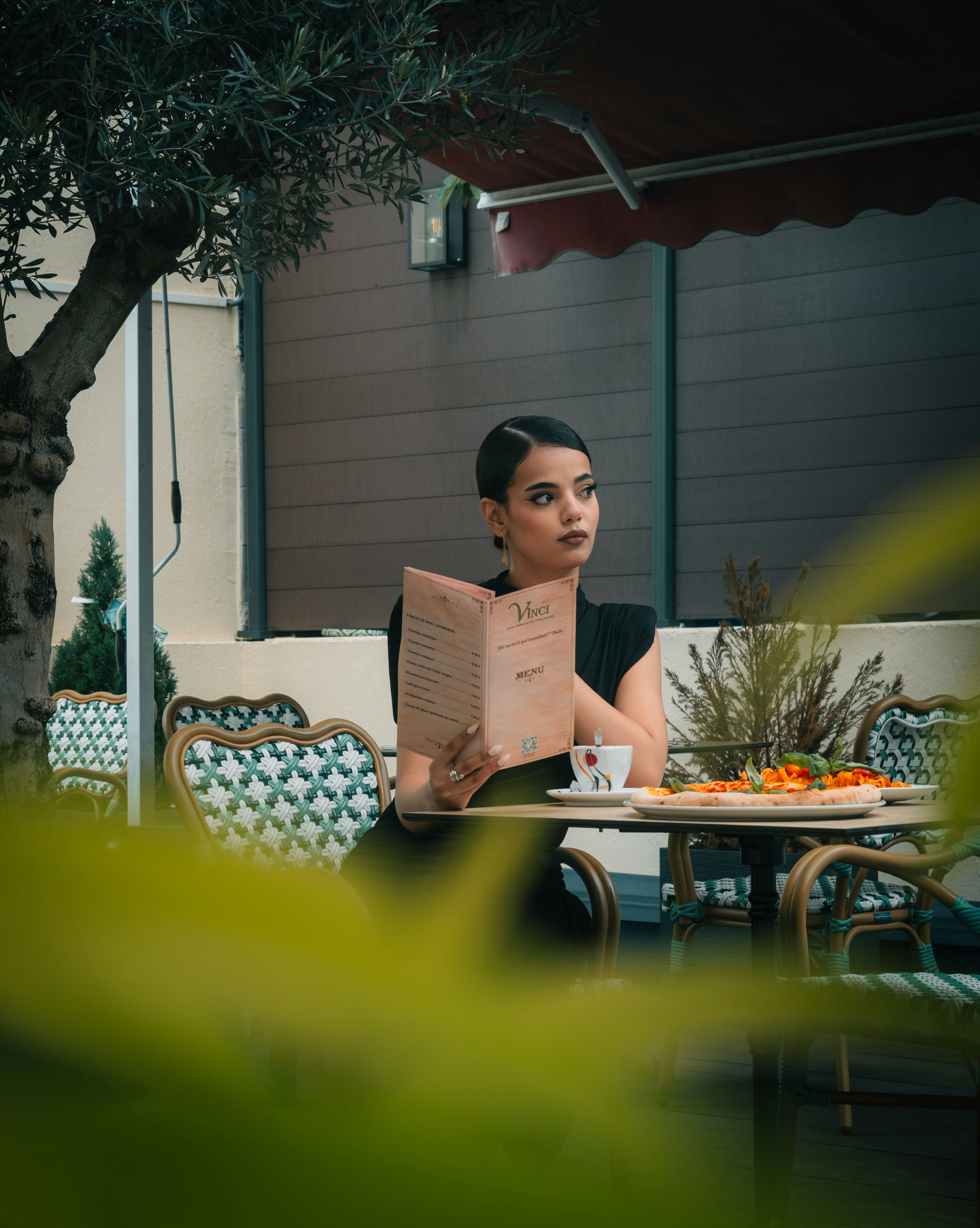 Cafe Scene: Poised Reader in Soft Afternoon Light