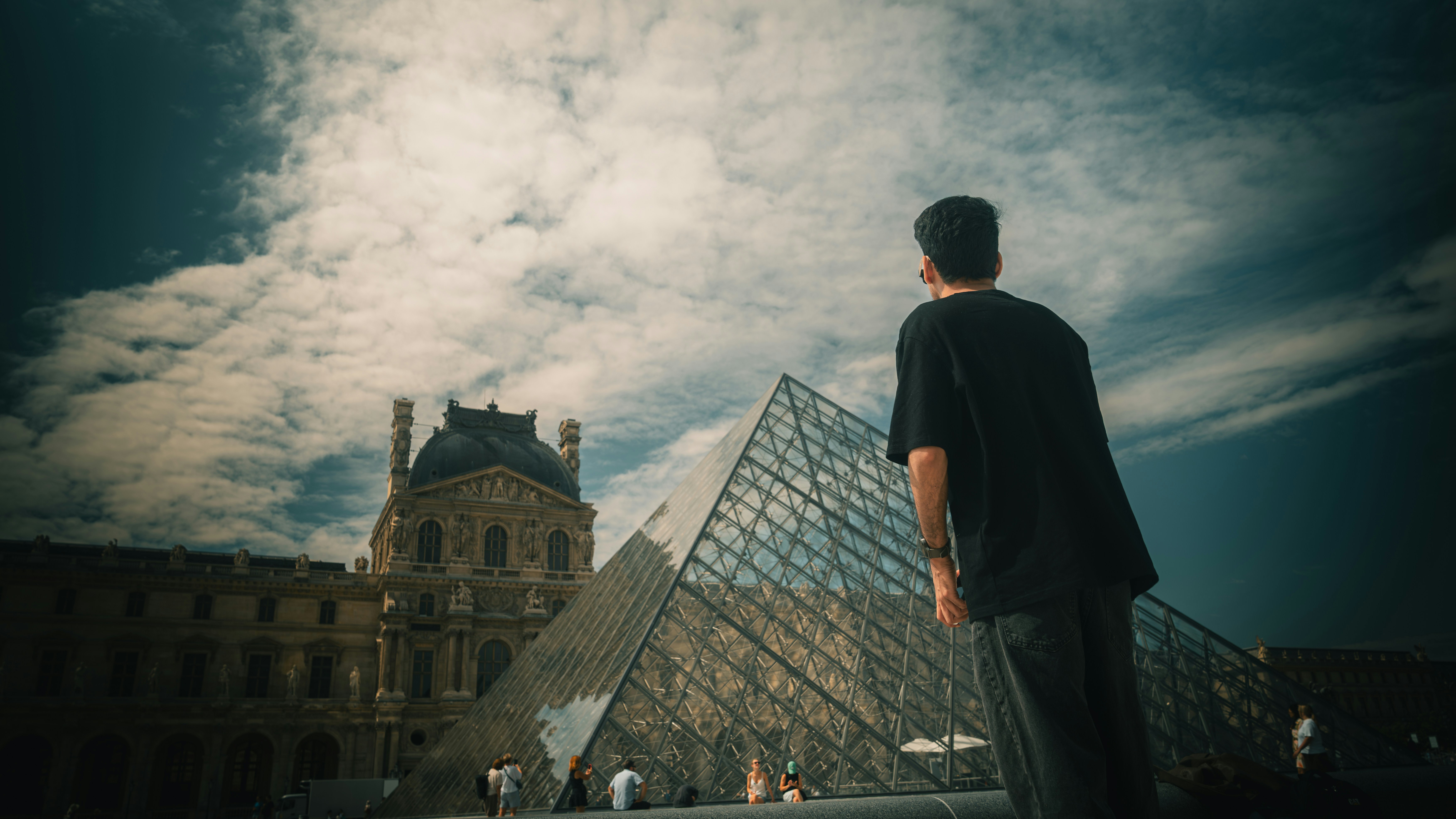 Museum Shadows: On Lookout by the Glass Pyramid
