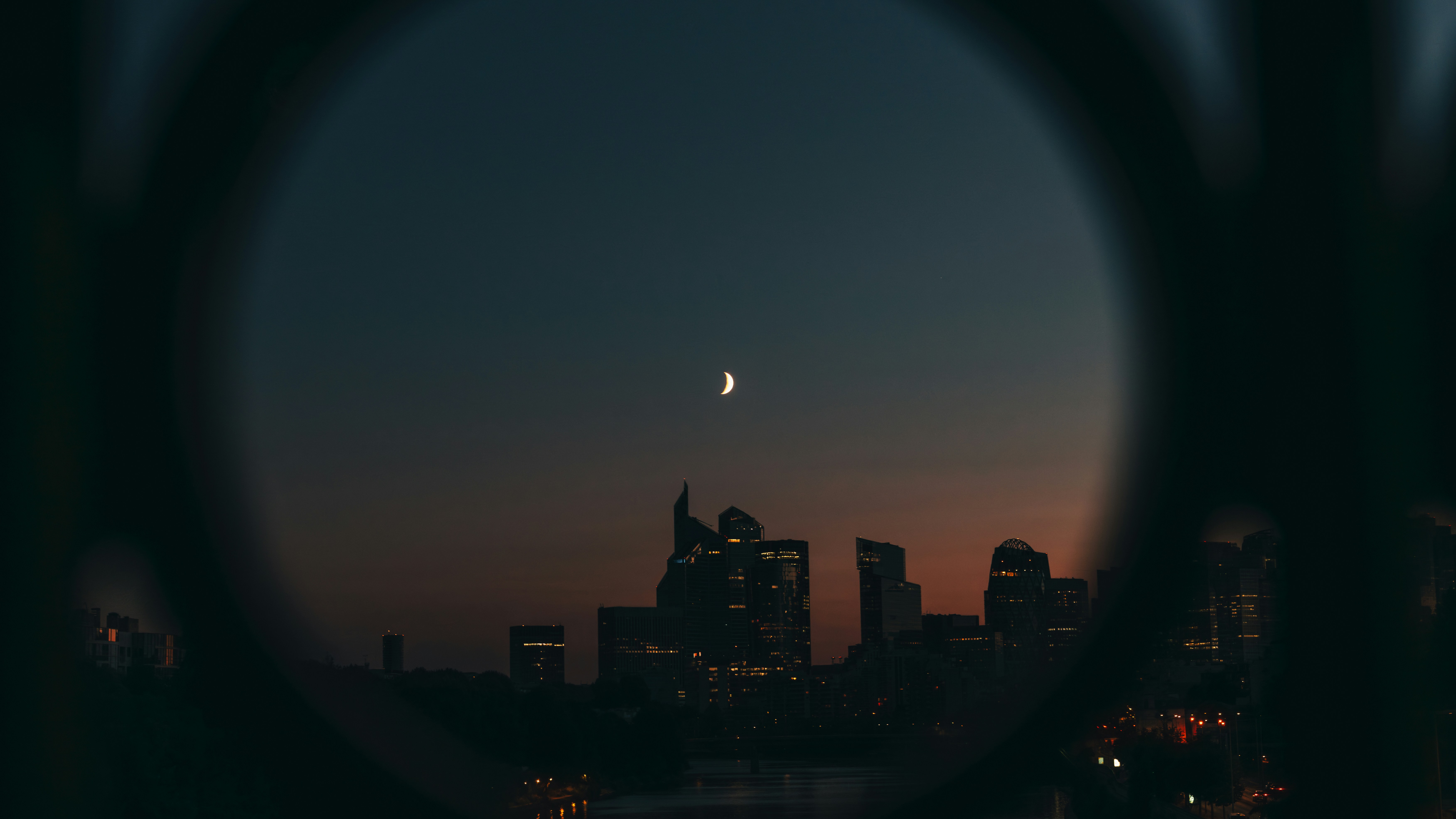 Moonlit Skyline Framed by the Lens