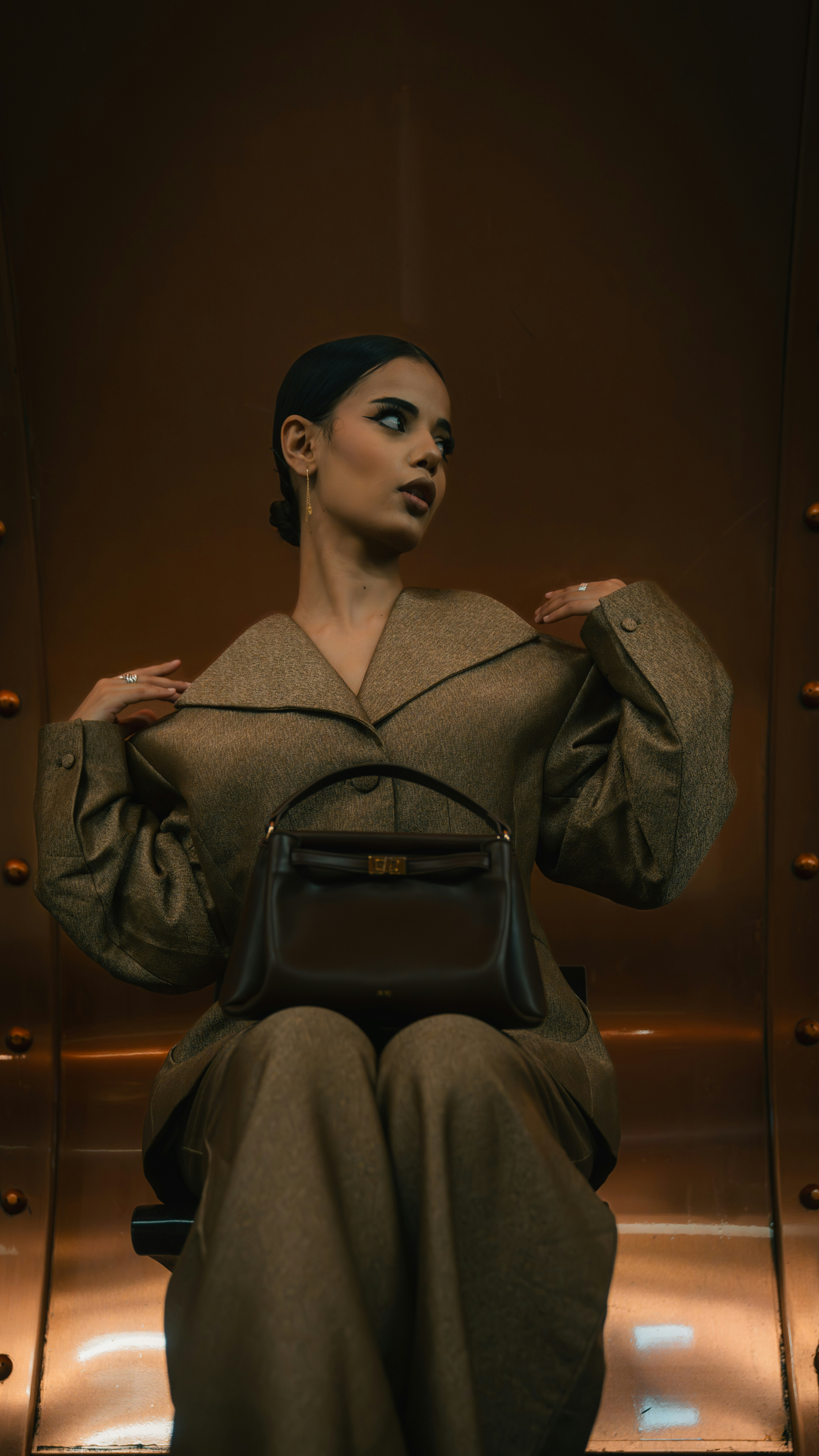A Dip in Bronzed Stillness: Portrait in a Copper Cage