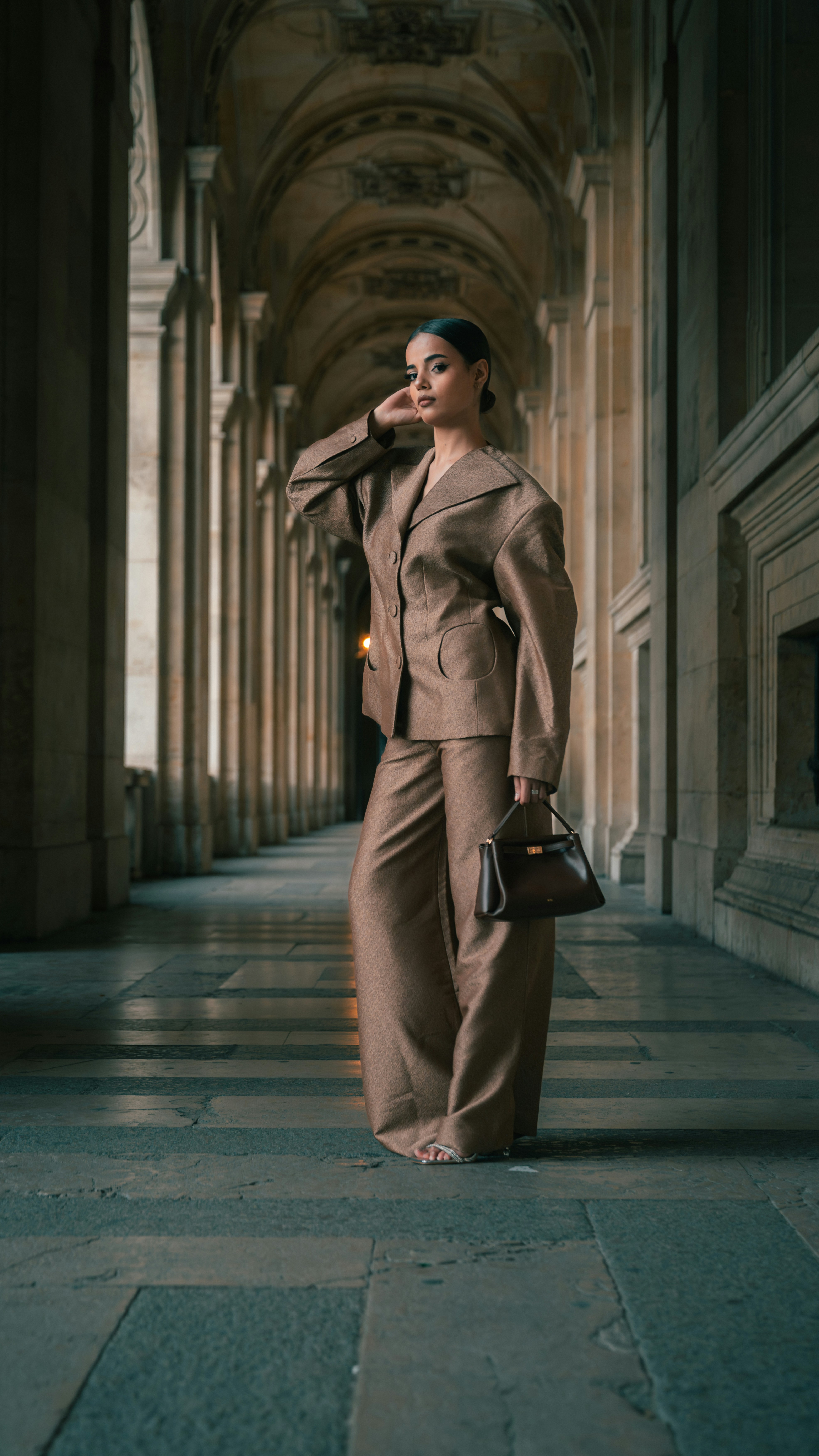 Architectural Poise: A Fashioned Walk in Subtle Sepia