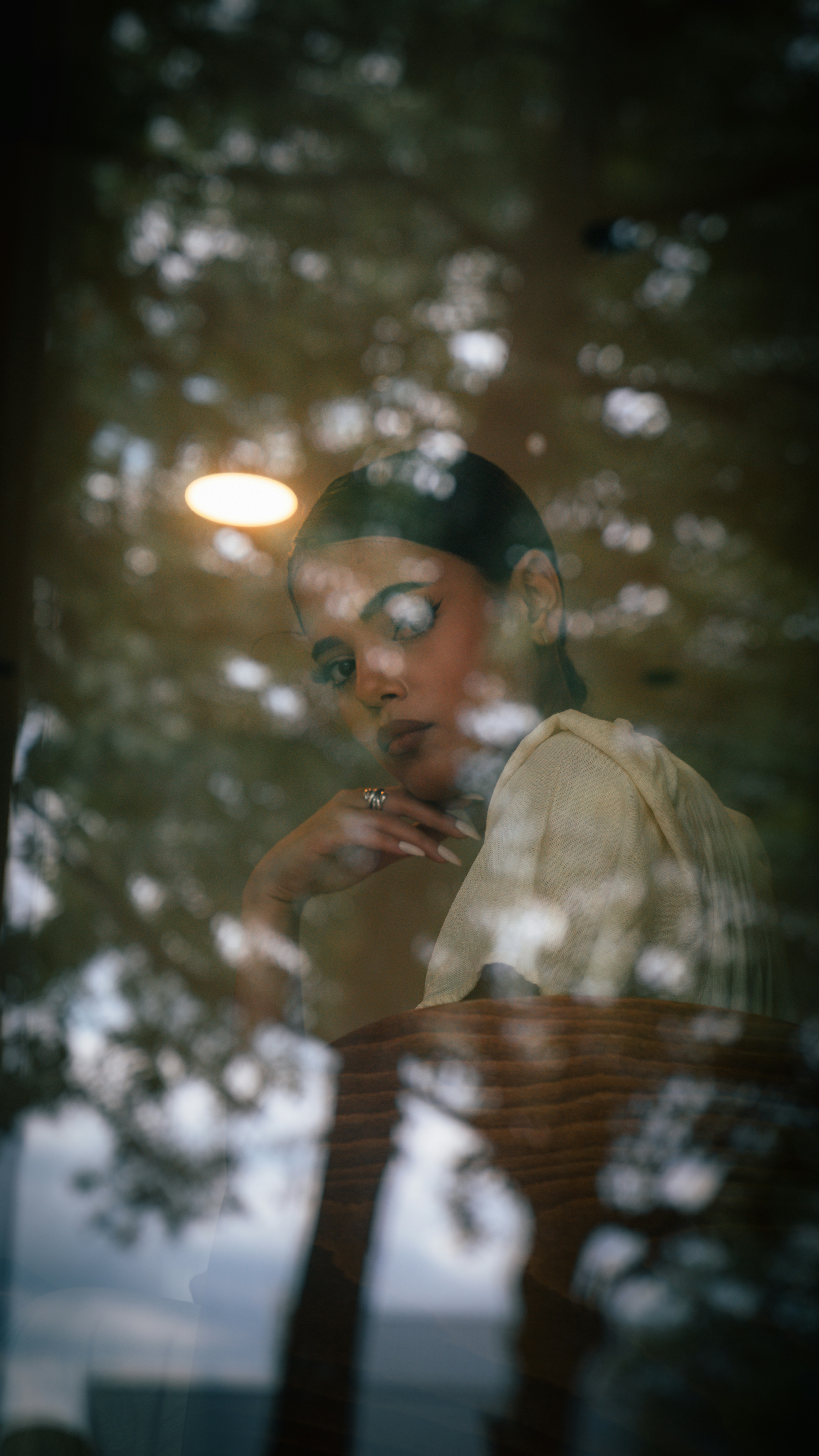 Glimmer of Portrait in Glass: A Quiet Moment with Reflections