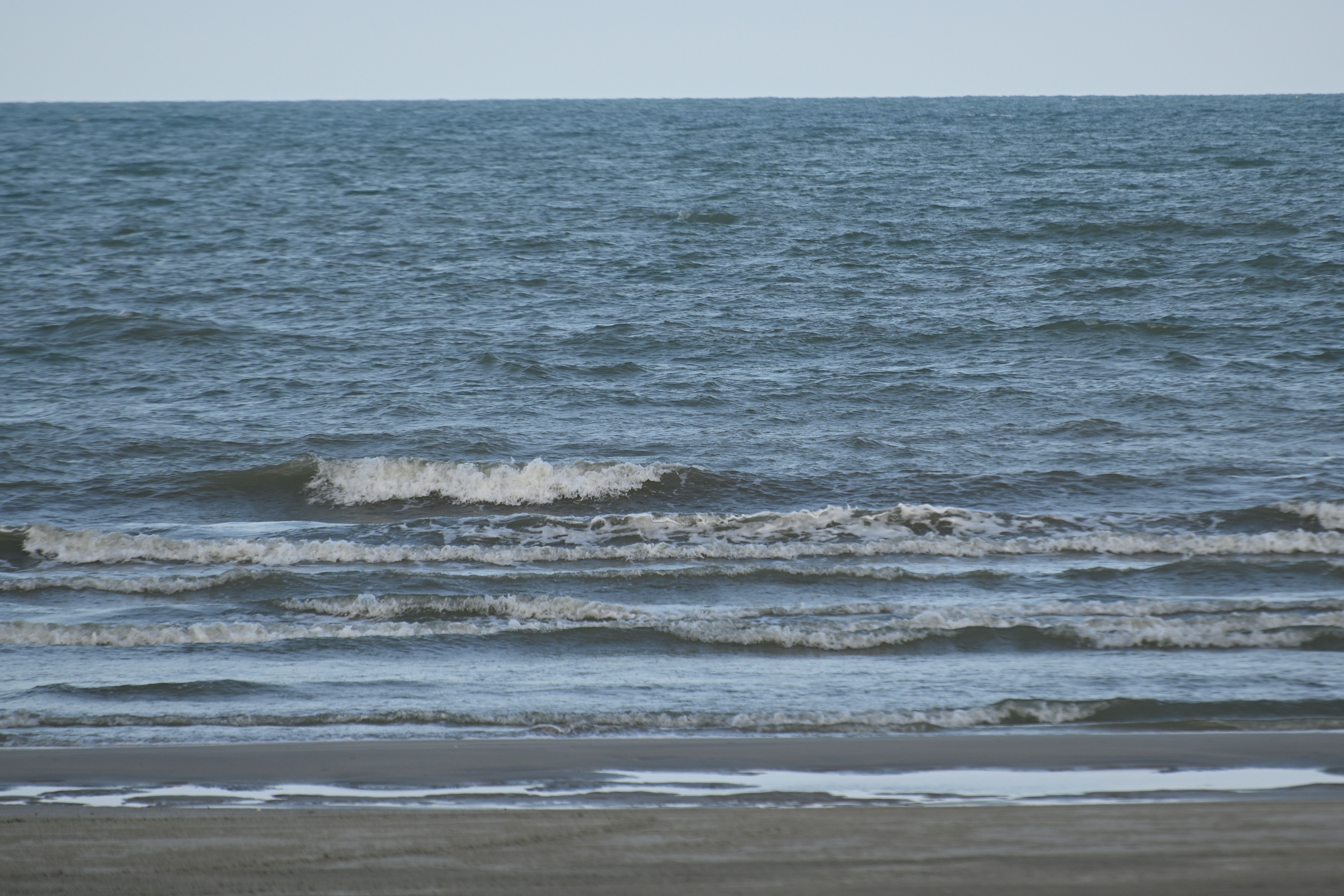 Distant Breakers at the Quiet Edge of Shore