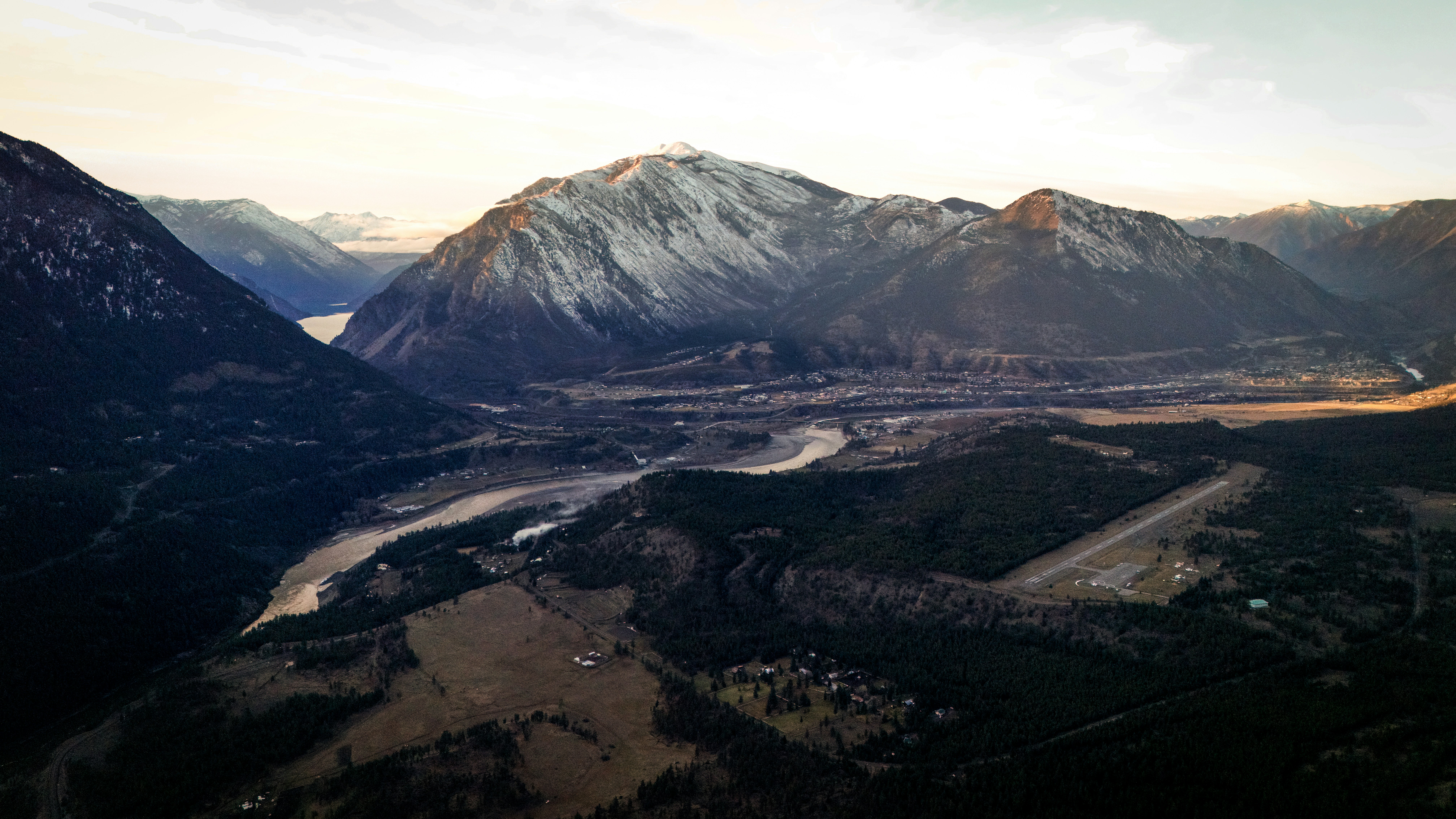 Snow-kissed Peaks Over a Quiet Valley