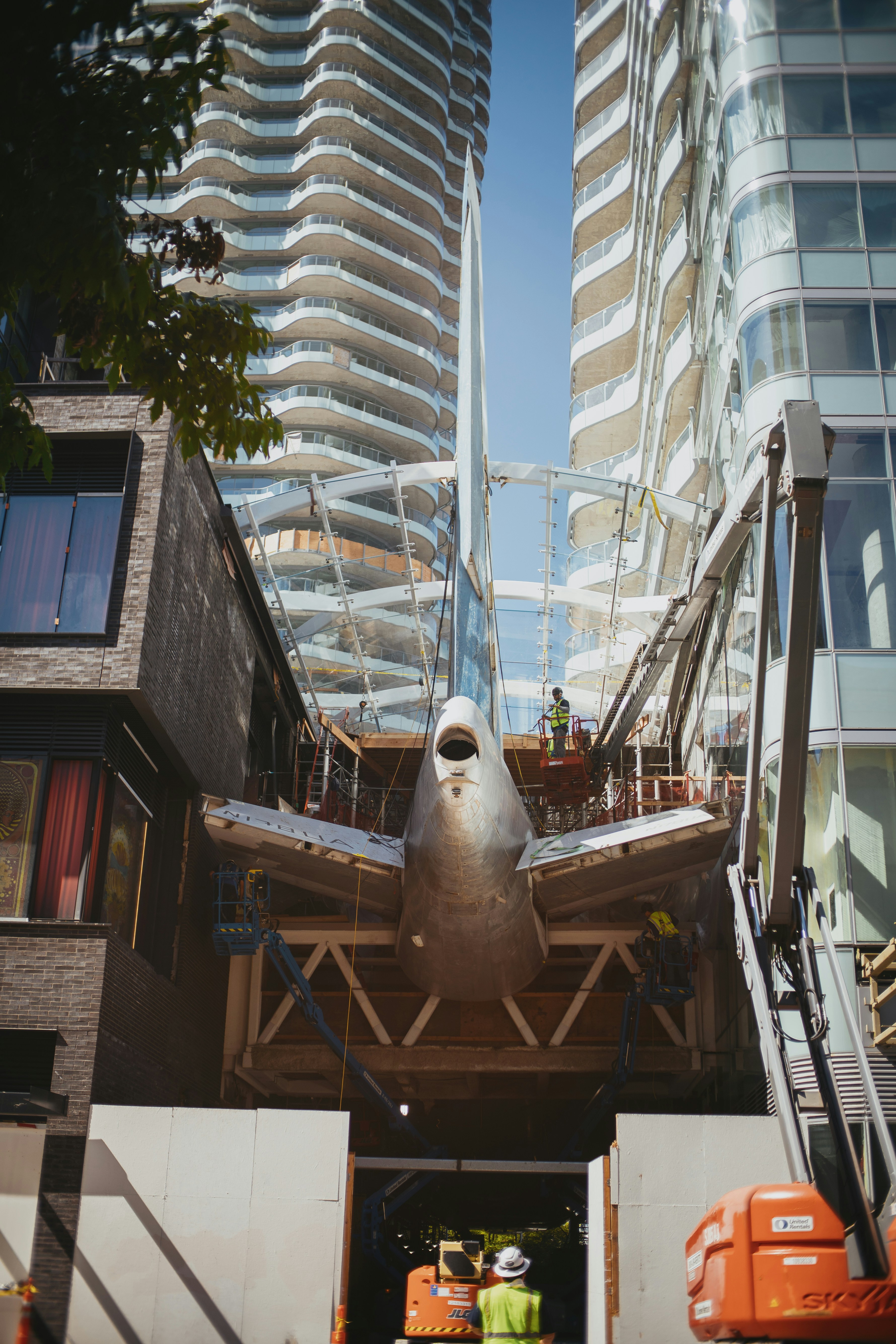 Landing Gear Under Construction Between Urban Giants