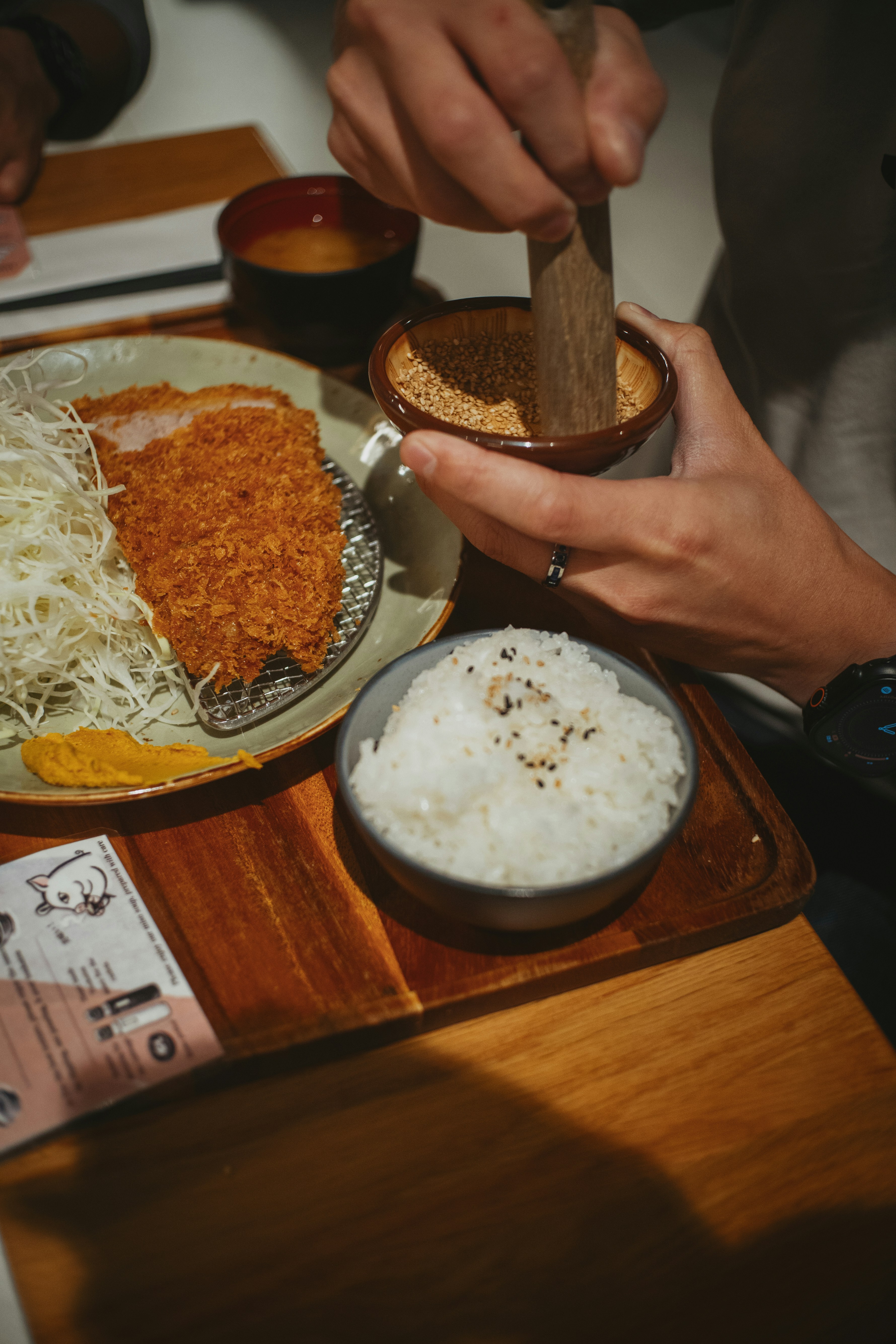 Crumbs and Rice: A Hands-on Moment of Grind and Grain