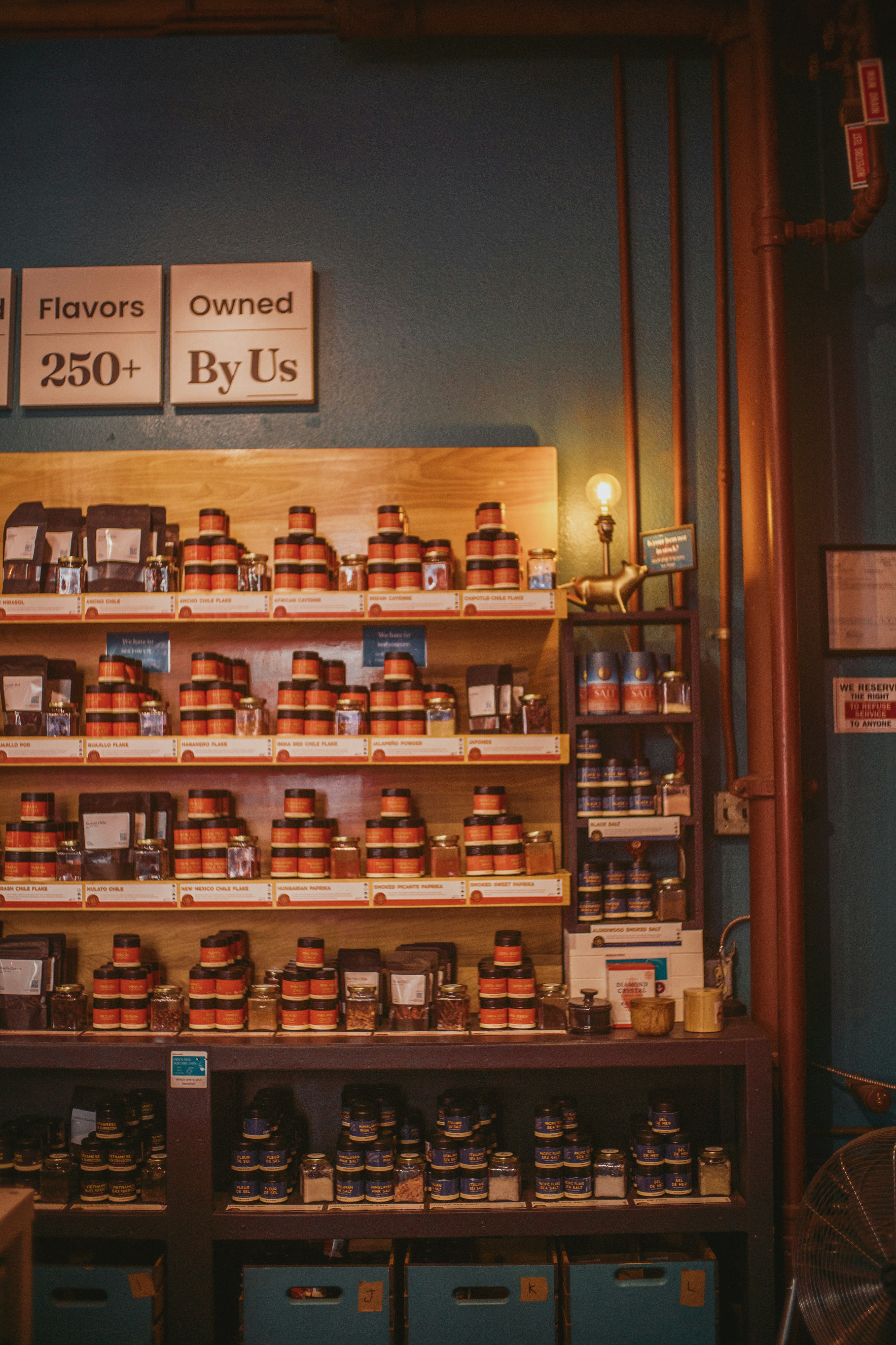 Shelf of Flavors: Copper-lidded Jars and Warmlit Shelves