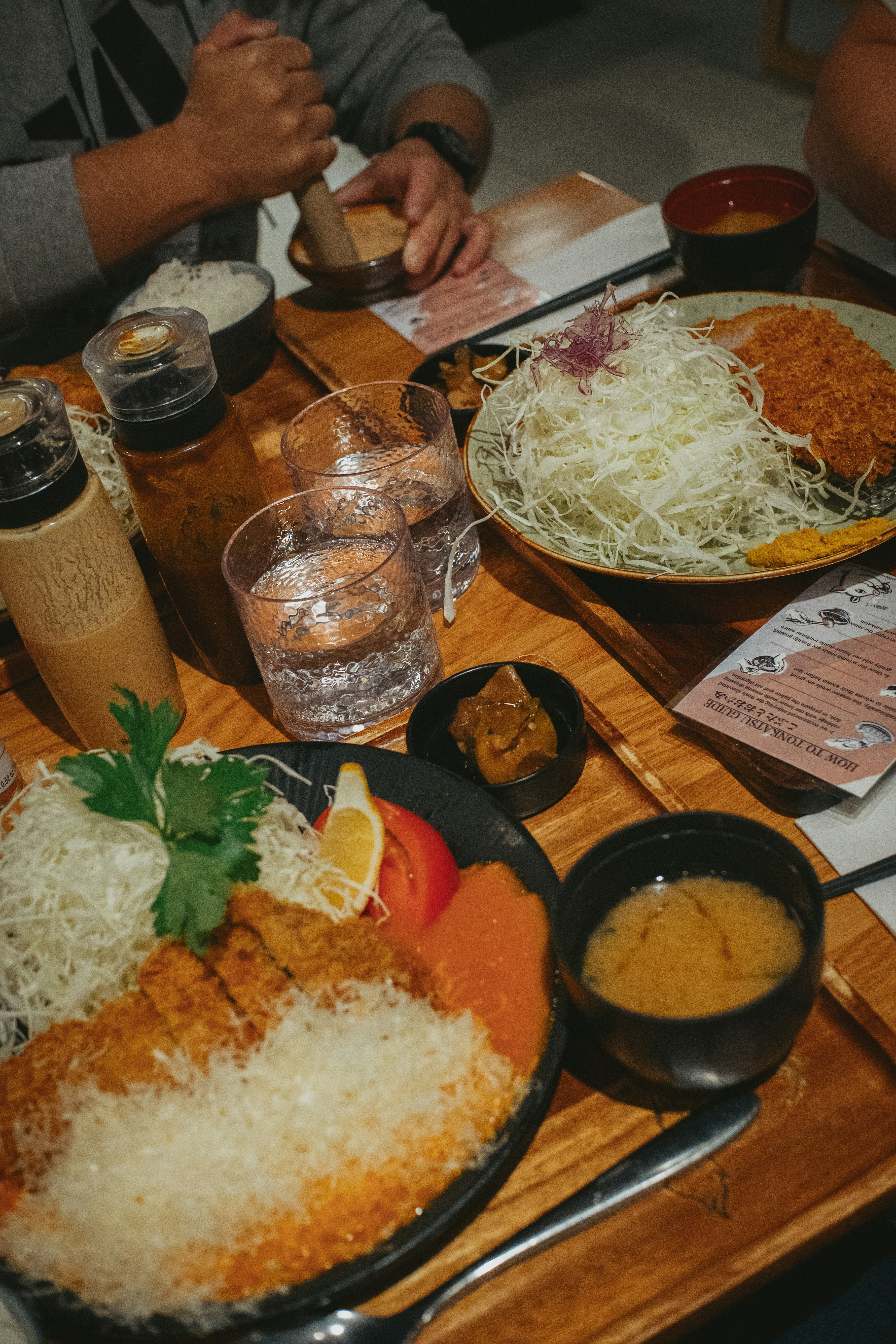 Crispy Tonkatsu Feast Shared Across a Wooden Table