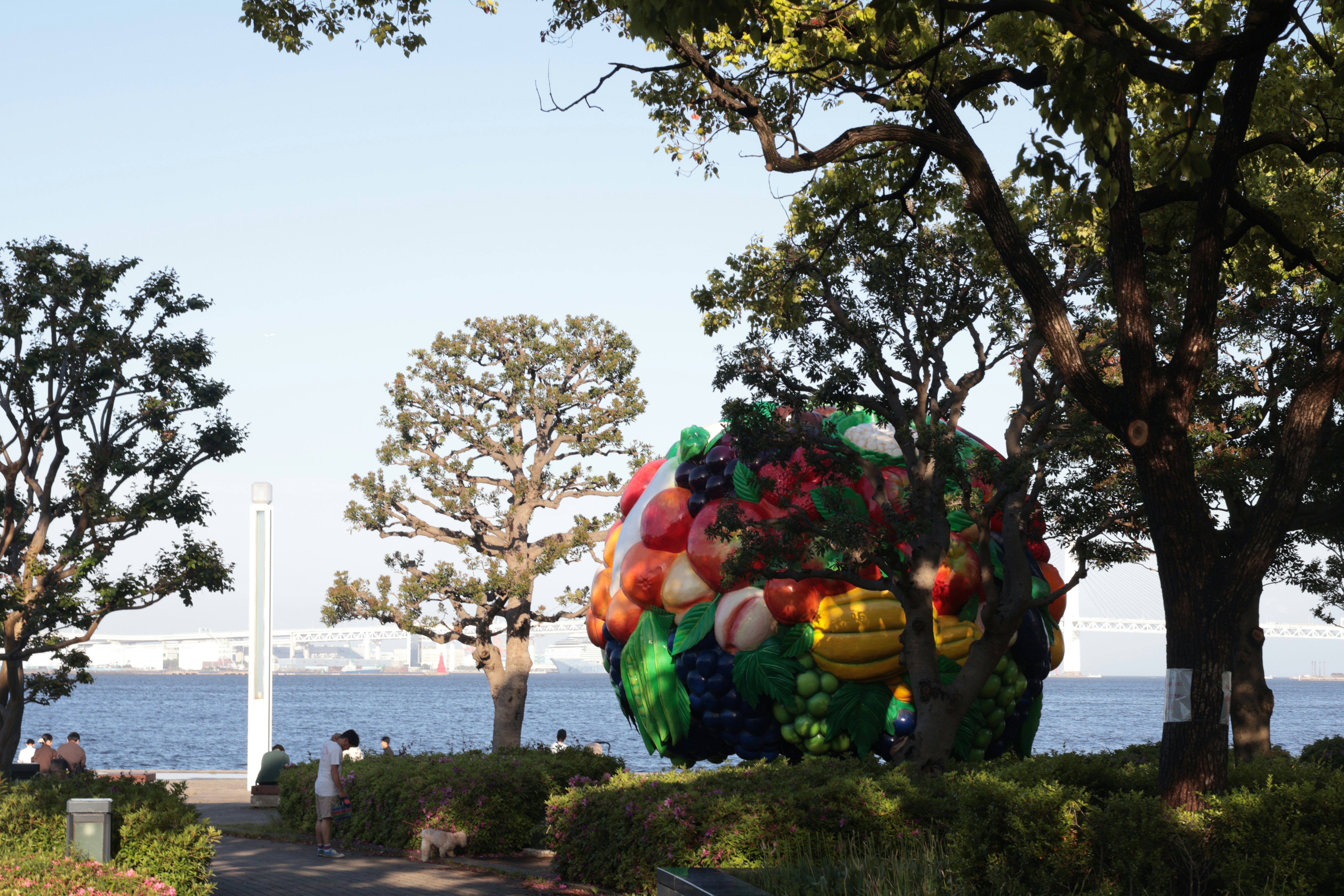 Floating Feast: A Garden of Giant Fruit by the Sea