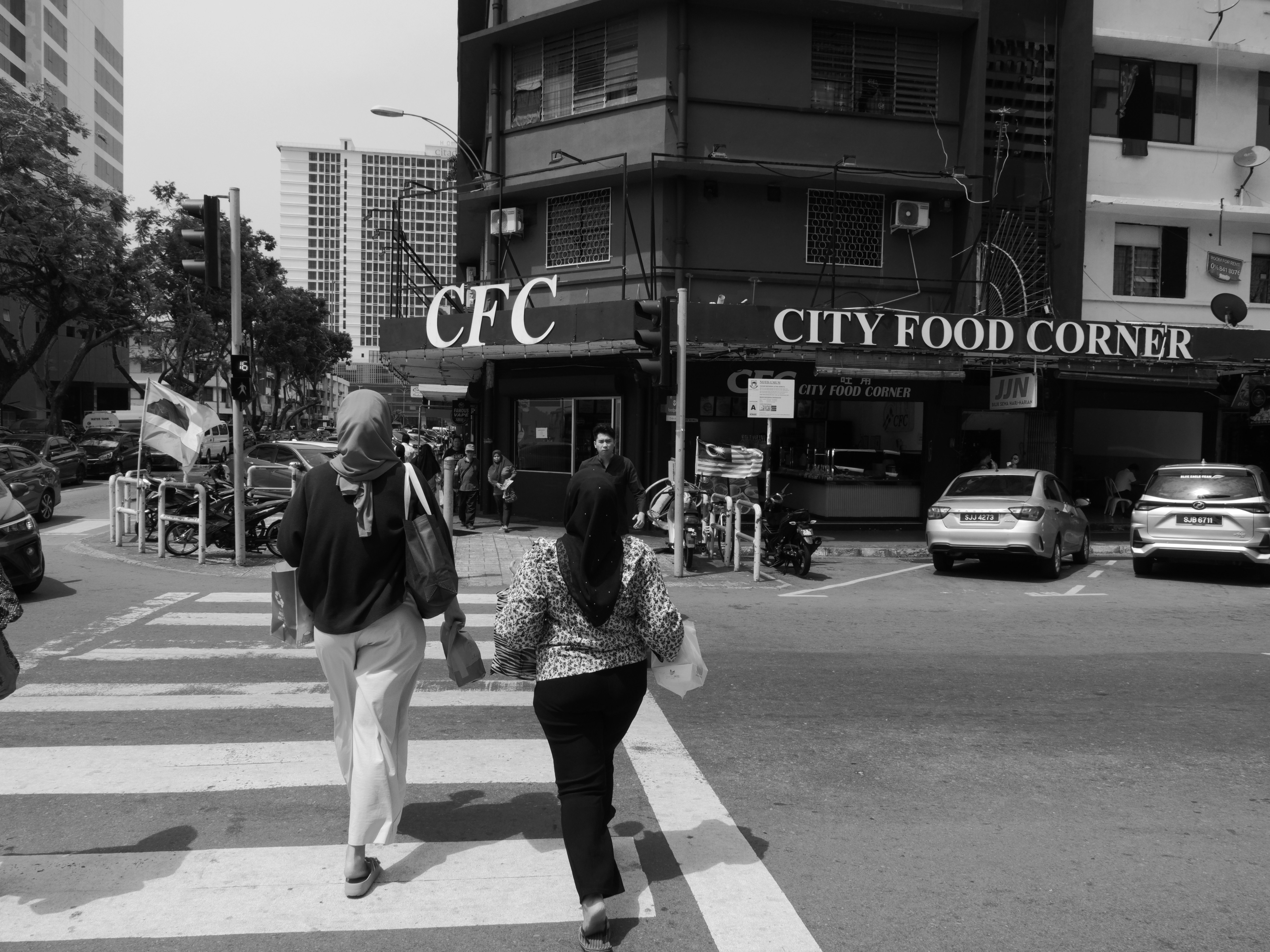 Crosswalk Echo: People Turn the Corner of City Food
