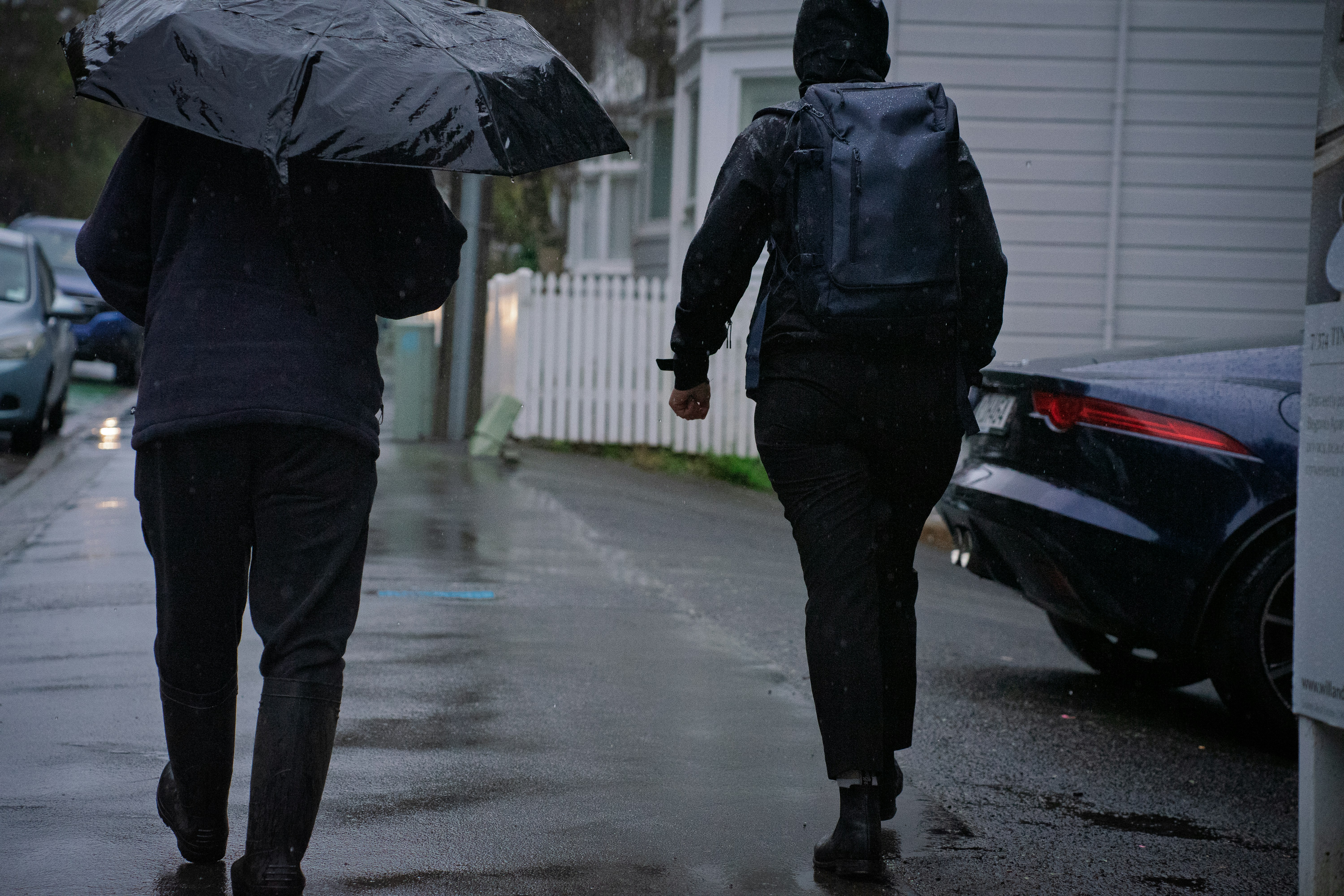Rain-Soaked Strides: Two Surreptitious Journeys Down a Quiet Street