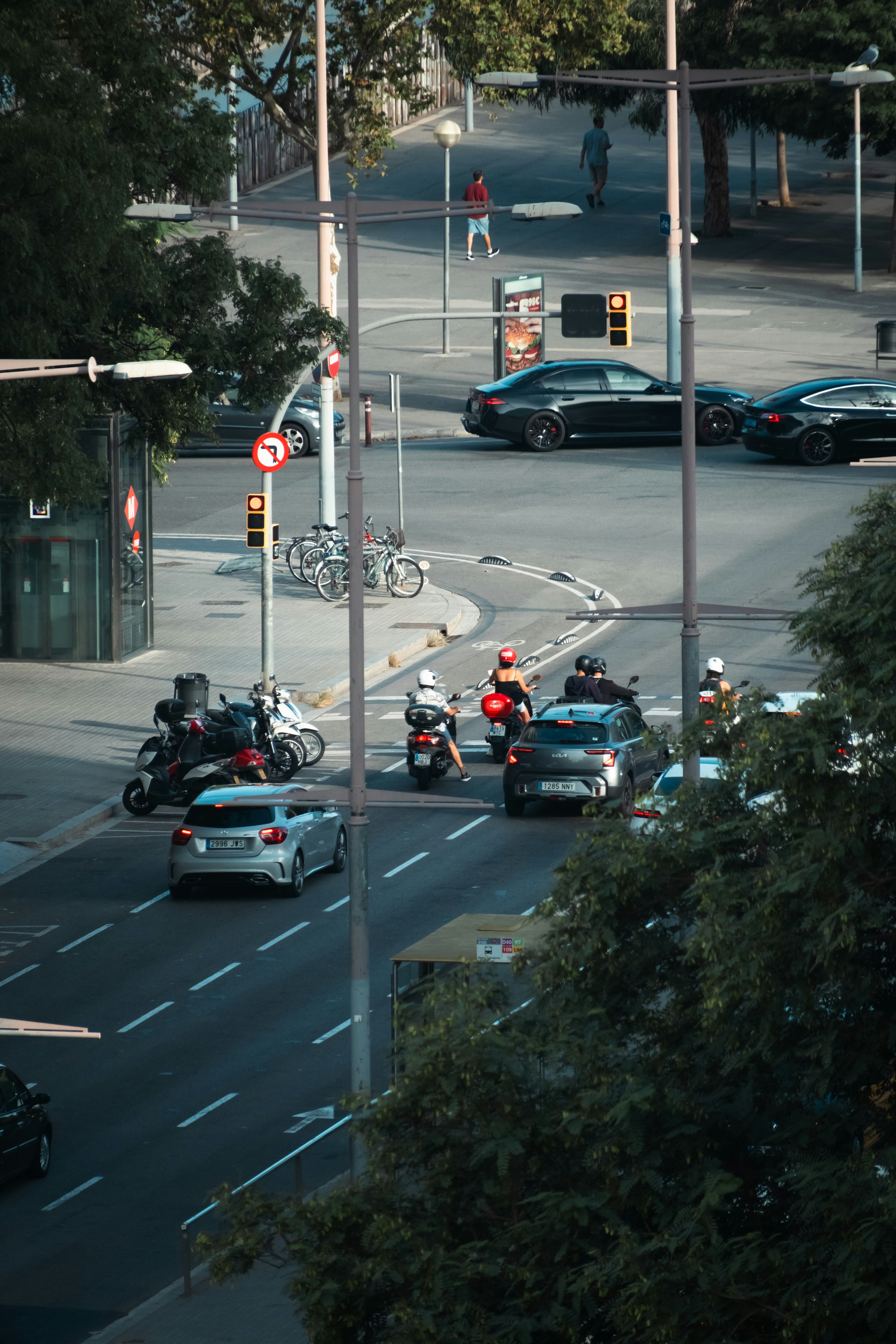 Urban Cascade: Cars, Motorbikes, and Pedestrians Aligned at a City Intersection
