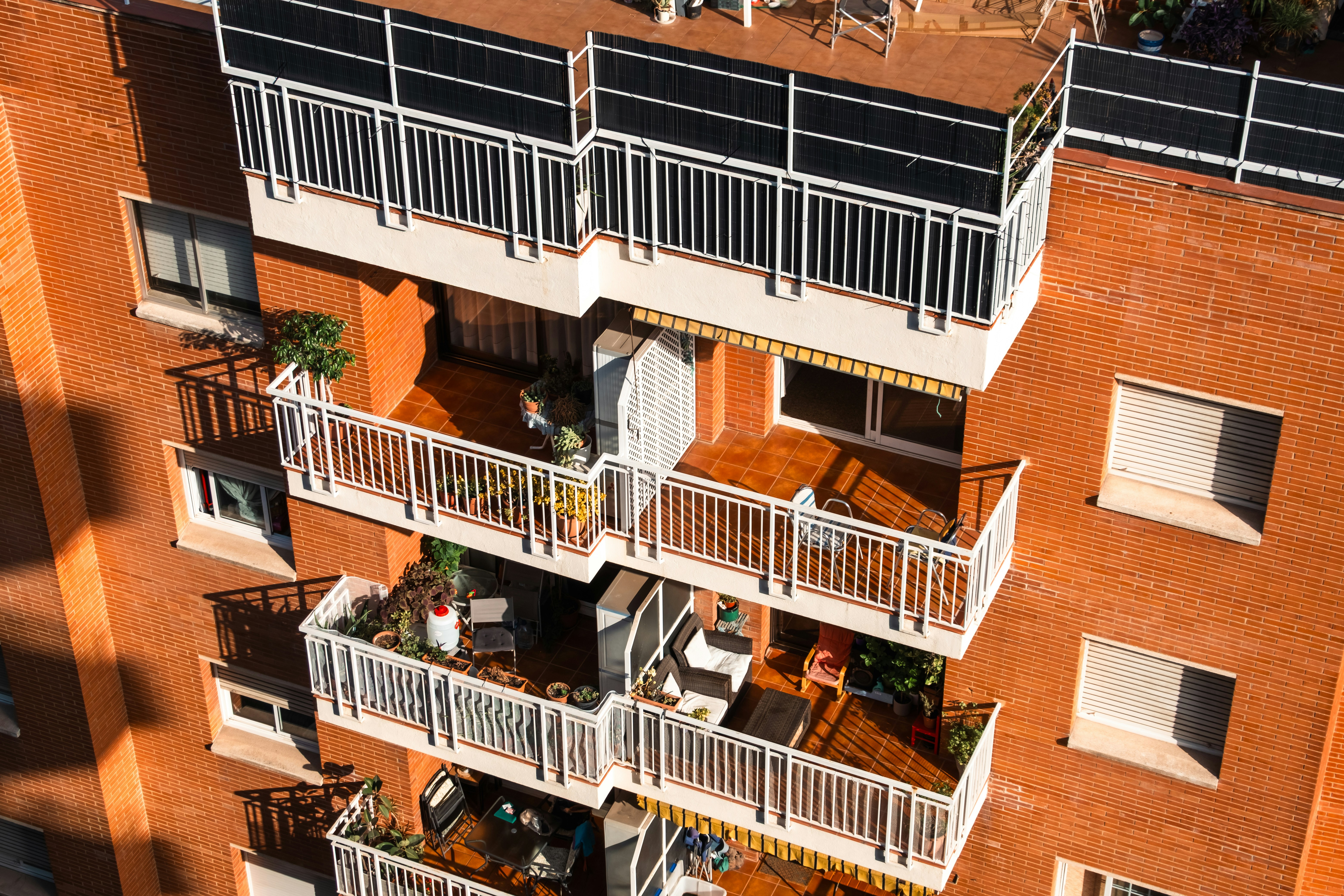 Sunlit Balcony Mosaic: A Vertical Slice of Urban Living