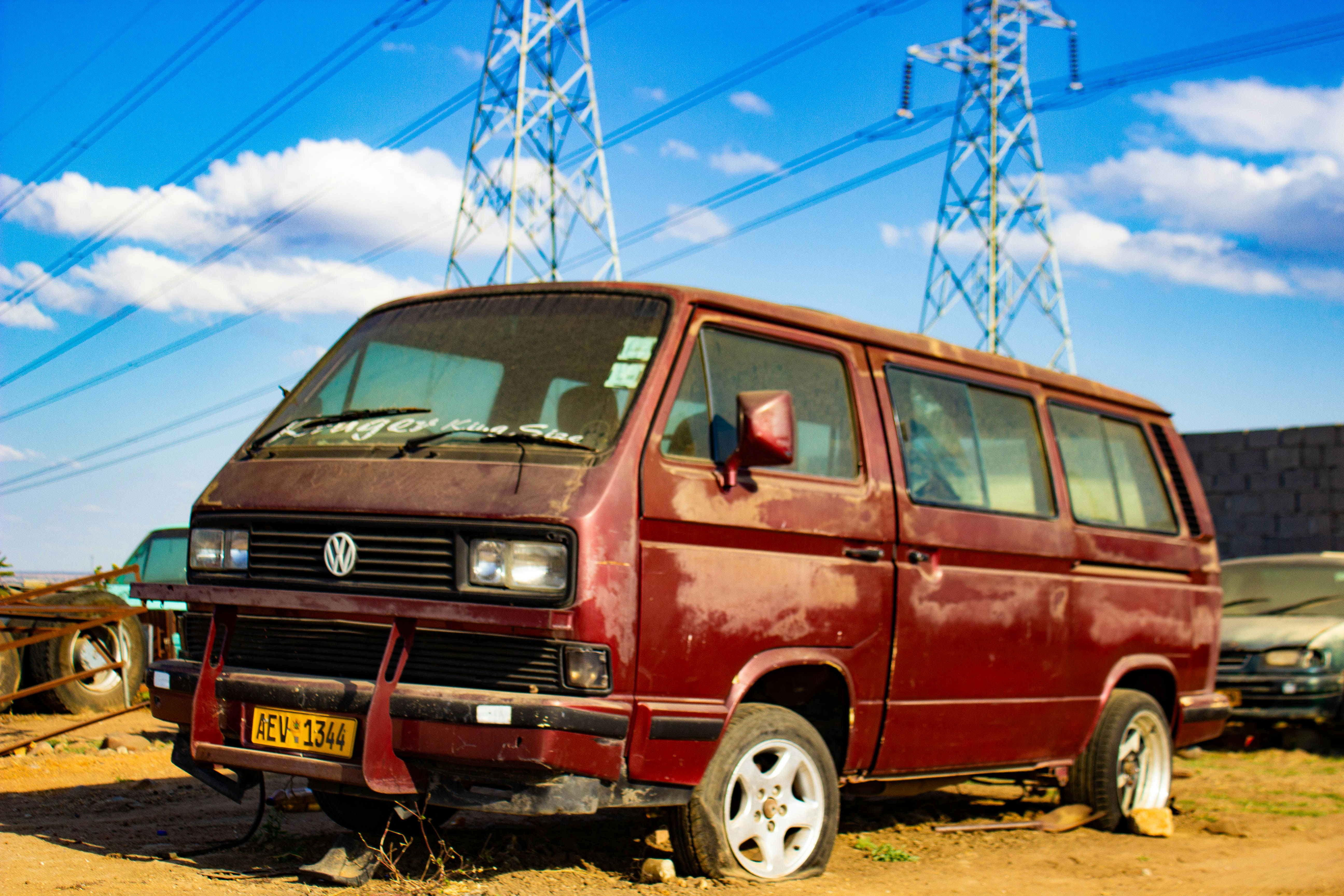 Dusty Red VW Van Resting Under an Open Sky