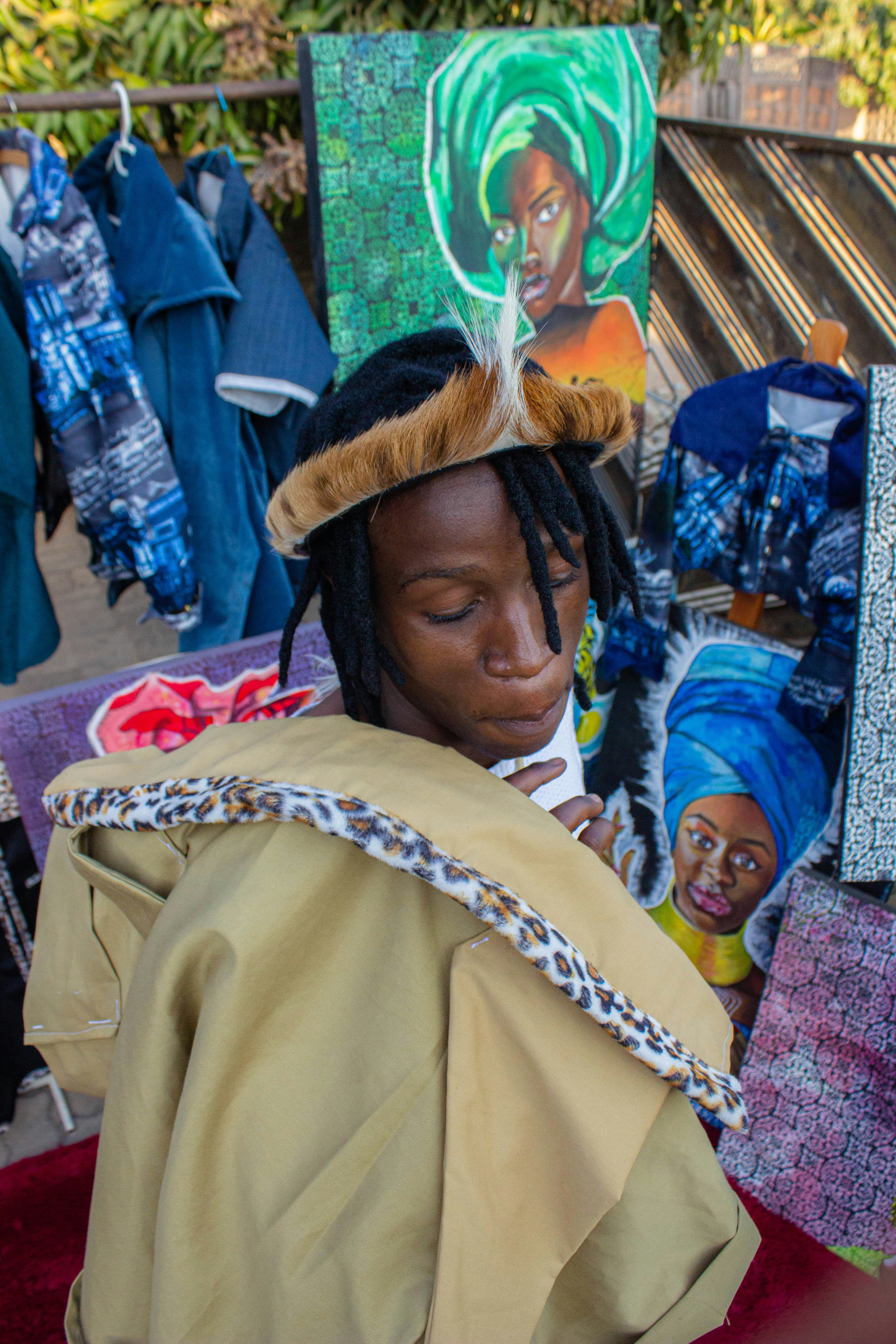 Portrait in a Market of Color: A Woolen Hood and Painted Faces