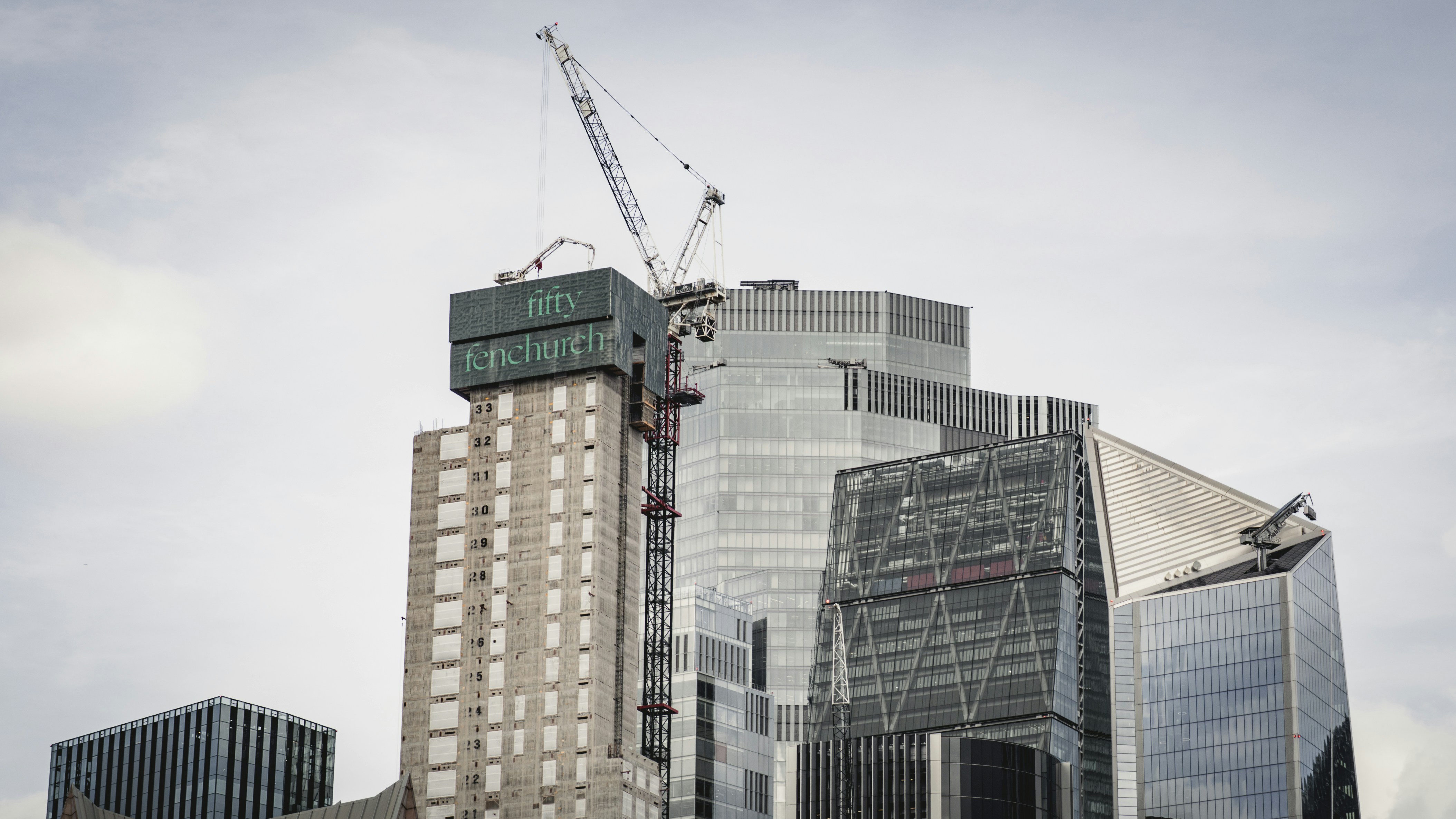 Skyscraper Mosaic: Crane and Glass above a City Core