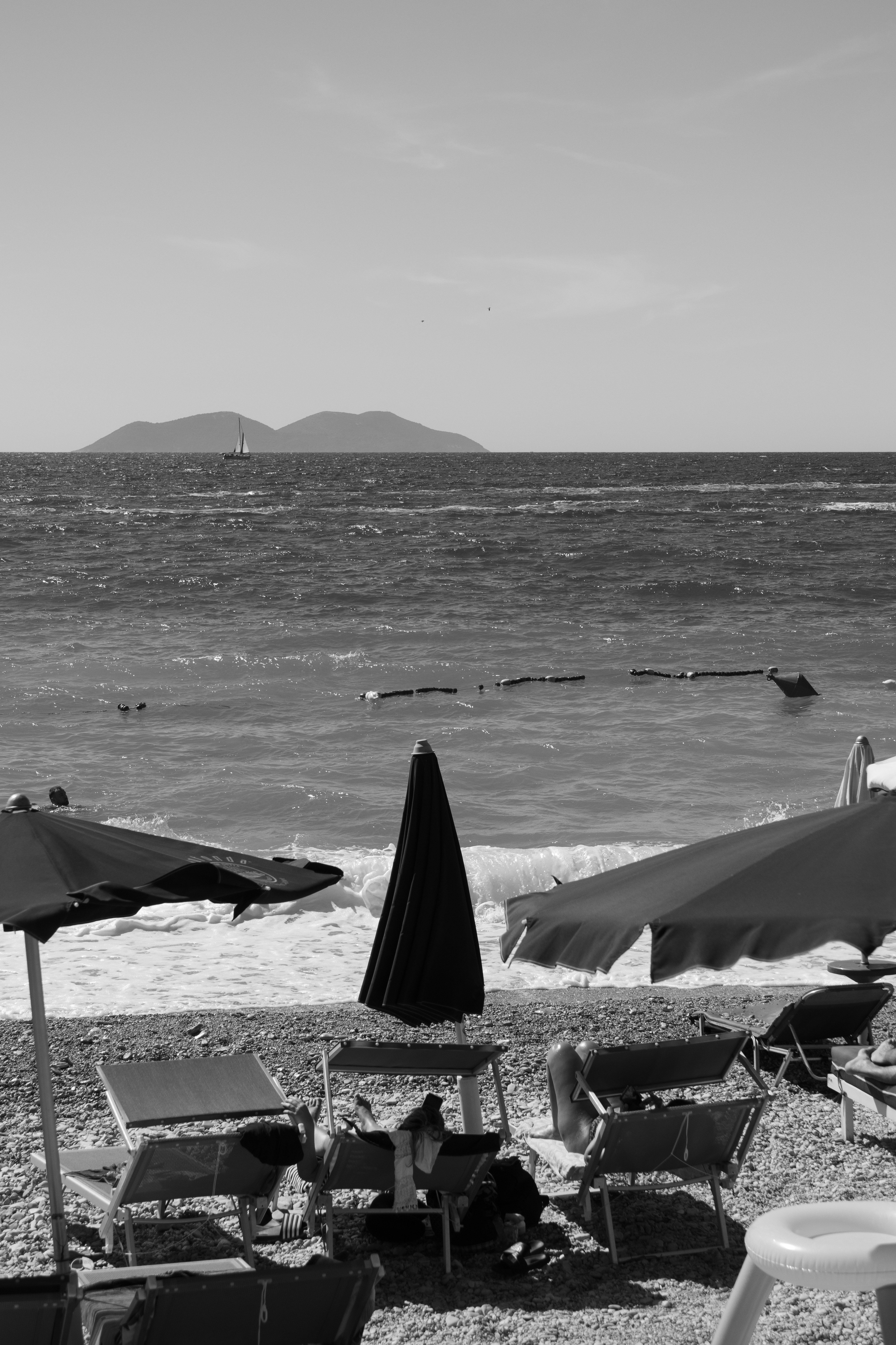 Sunlit Beach Chairs and Sea Beyond: Quiet Leisure by the Shore