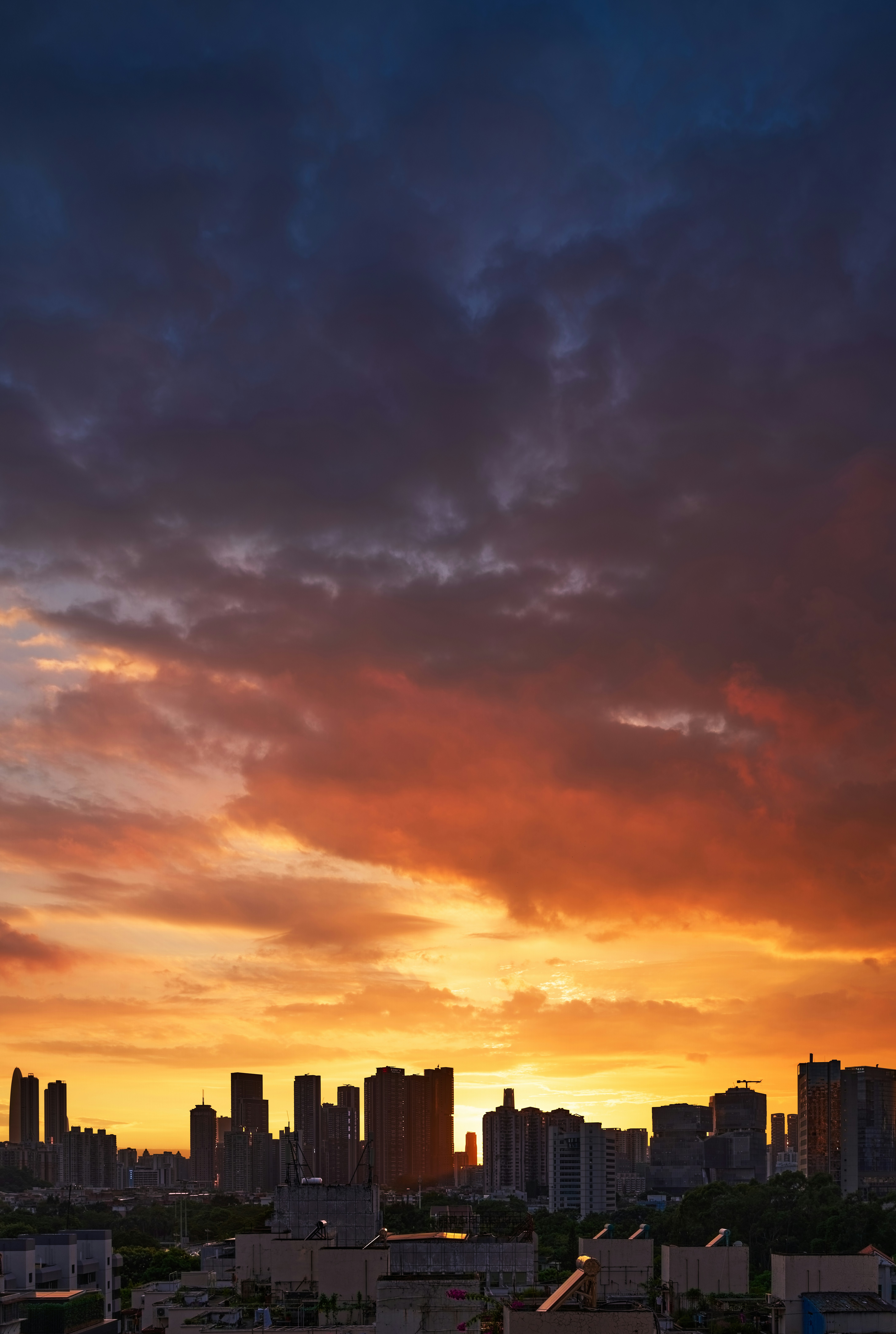 Sunset Over the City: silhouettes Against Fiery Skies