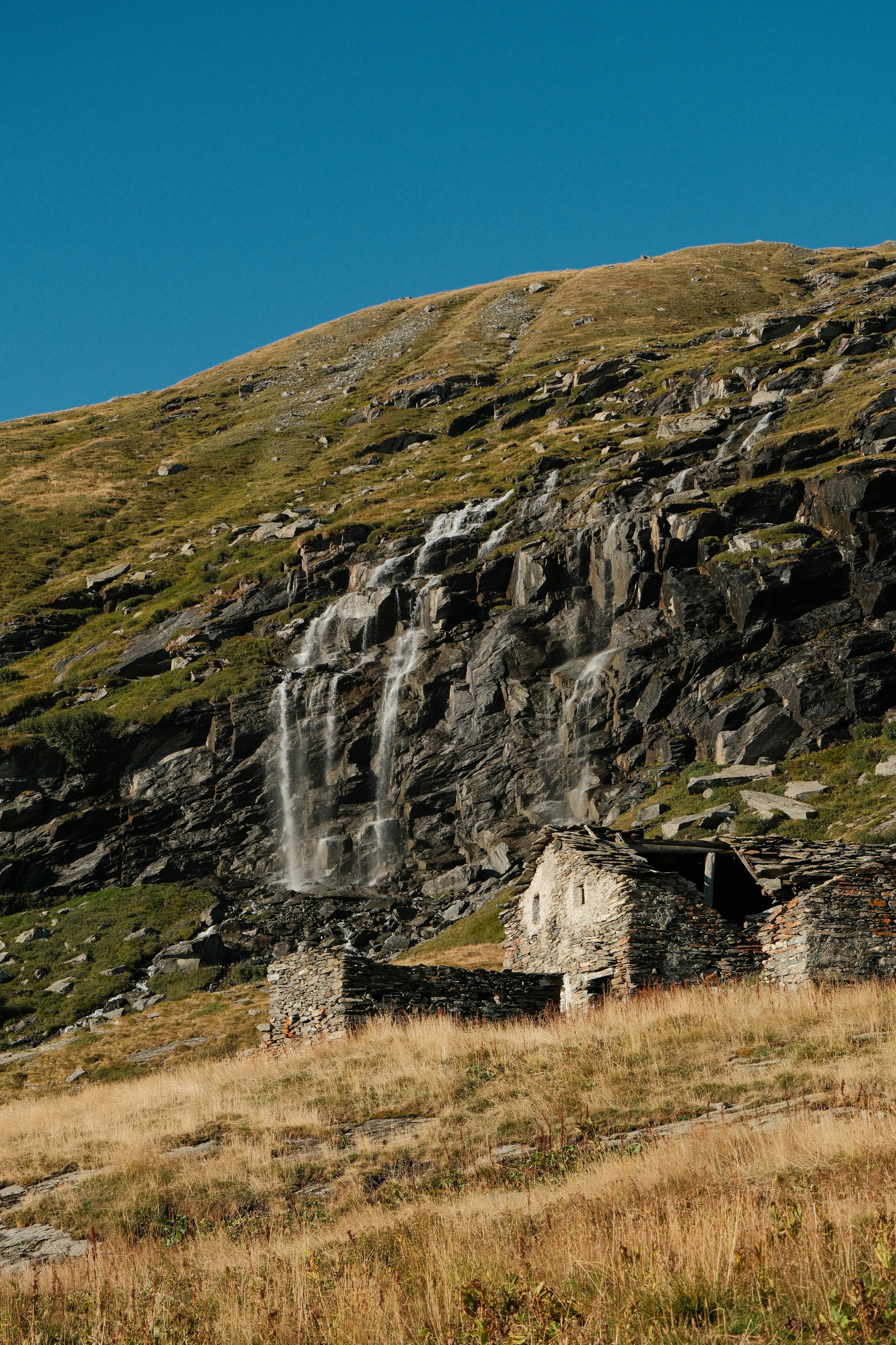 Remnant Stone Farm by the Slopes and a Silent Cascade