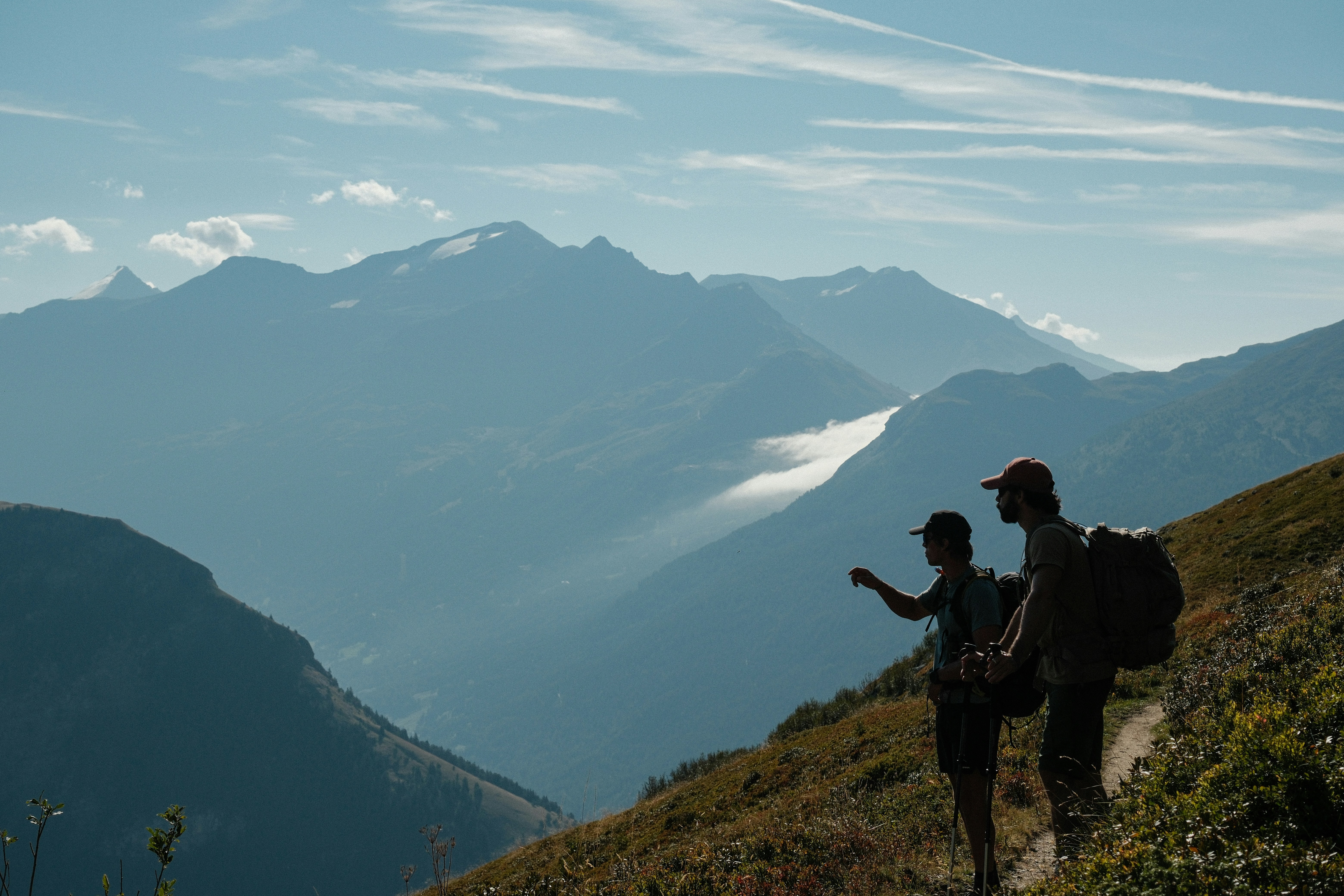 Hikers at the Knife-Edge of the Alps
