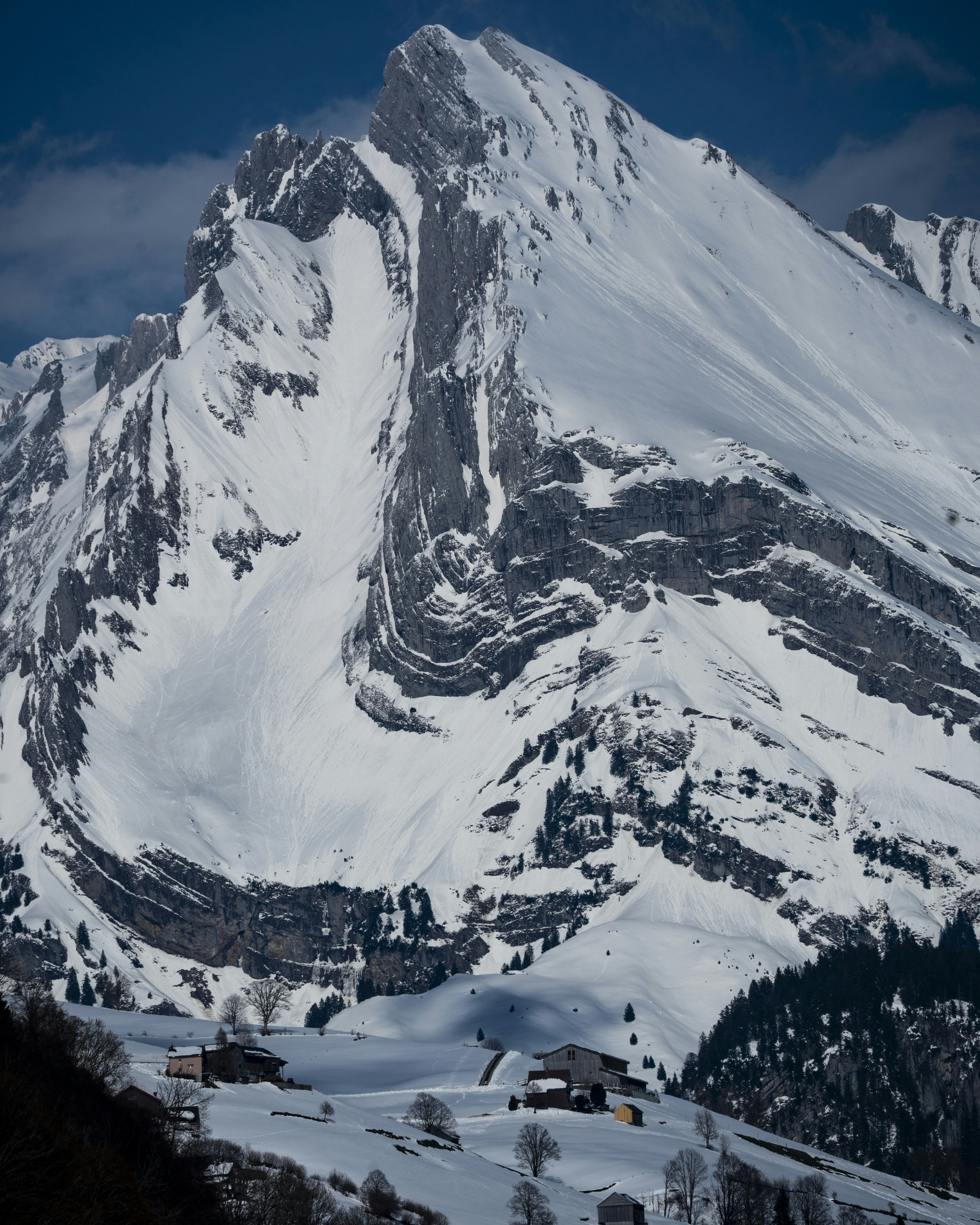 Summit Veil: Snow-Crowned Peaks Over a Quiet Alpine Village