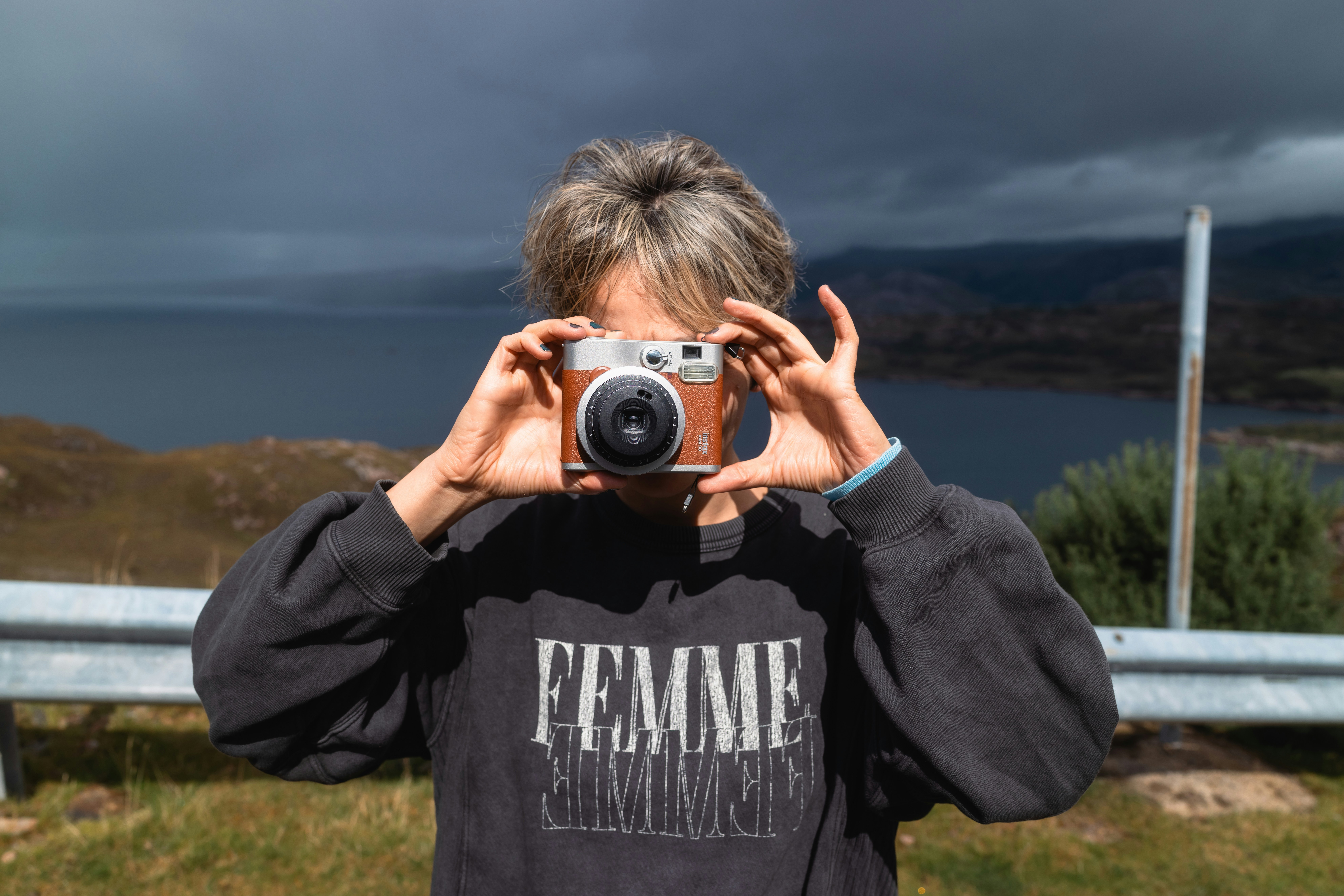 Behind the Viewfinder: A Sunny Moment with a Retro-Look Camera