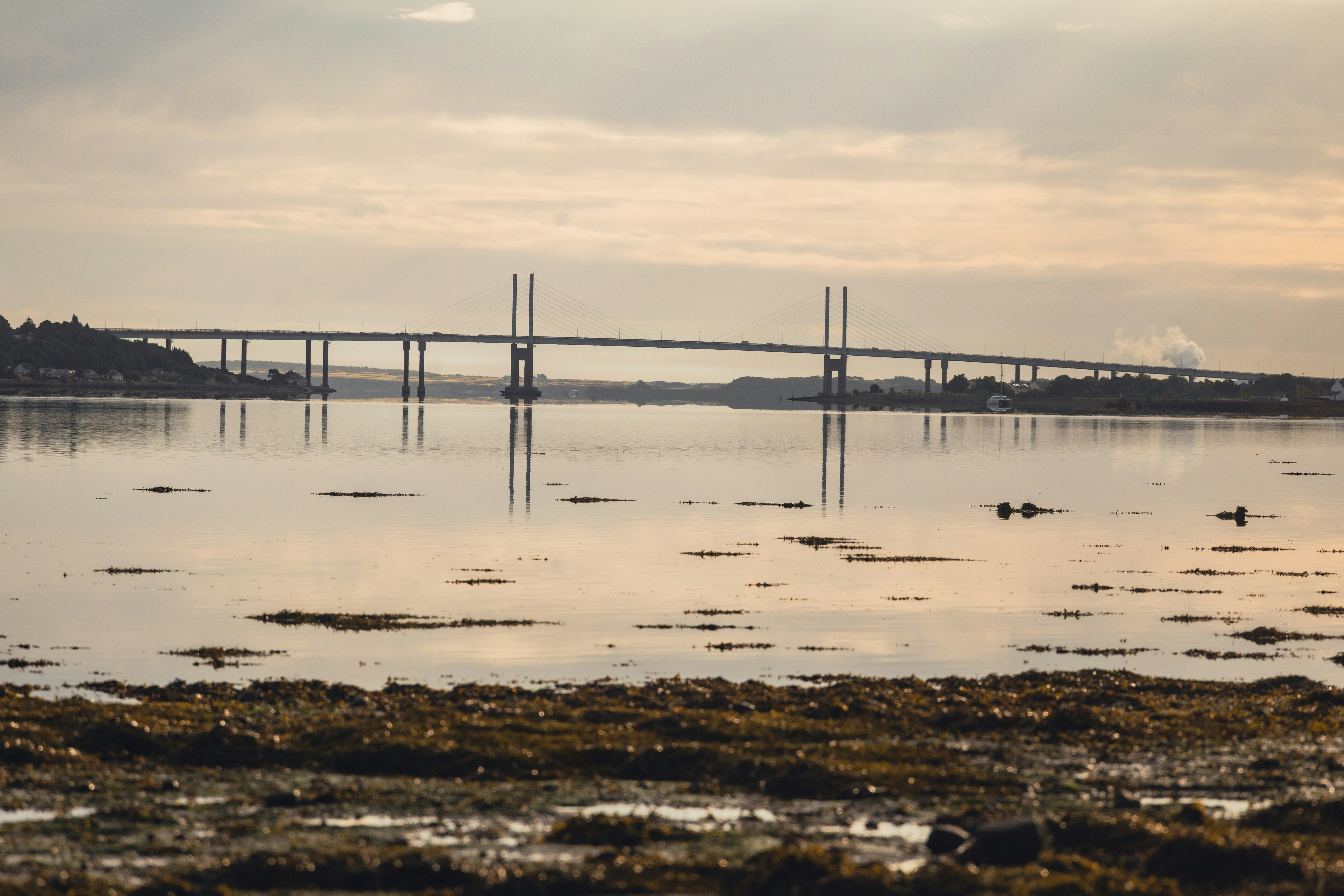 Calm Waters and Pier Silhouettes at Dusk