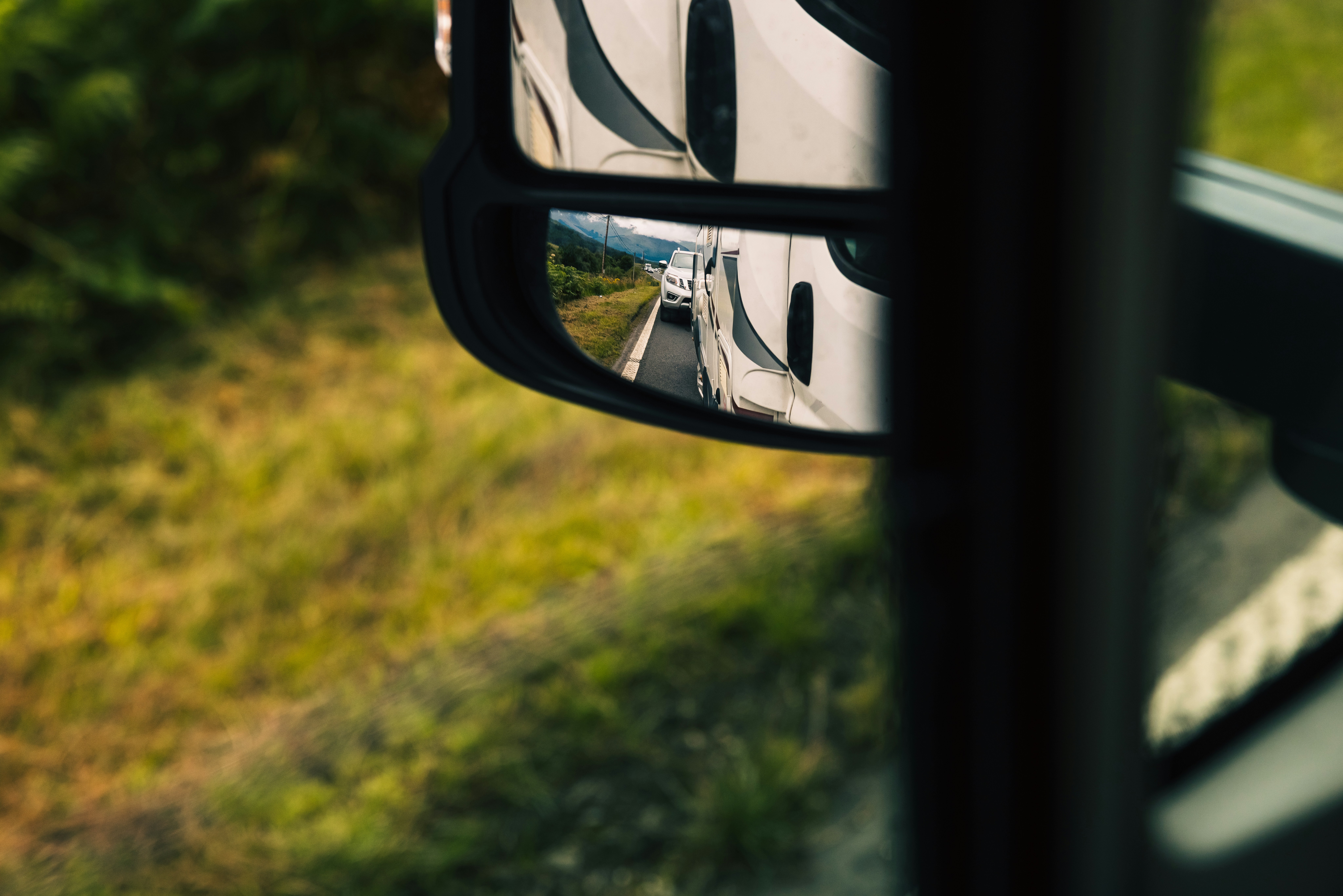 Rear-View Road Mirror: A Line of Vehicles in a Narrow Highway