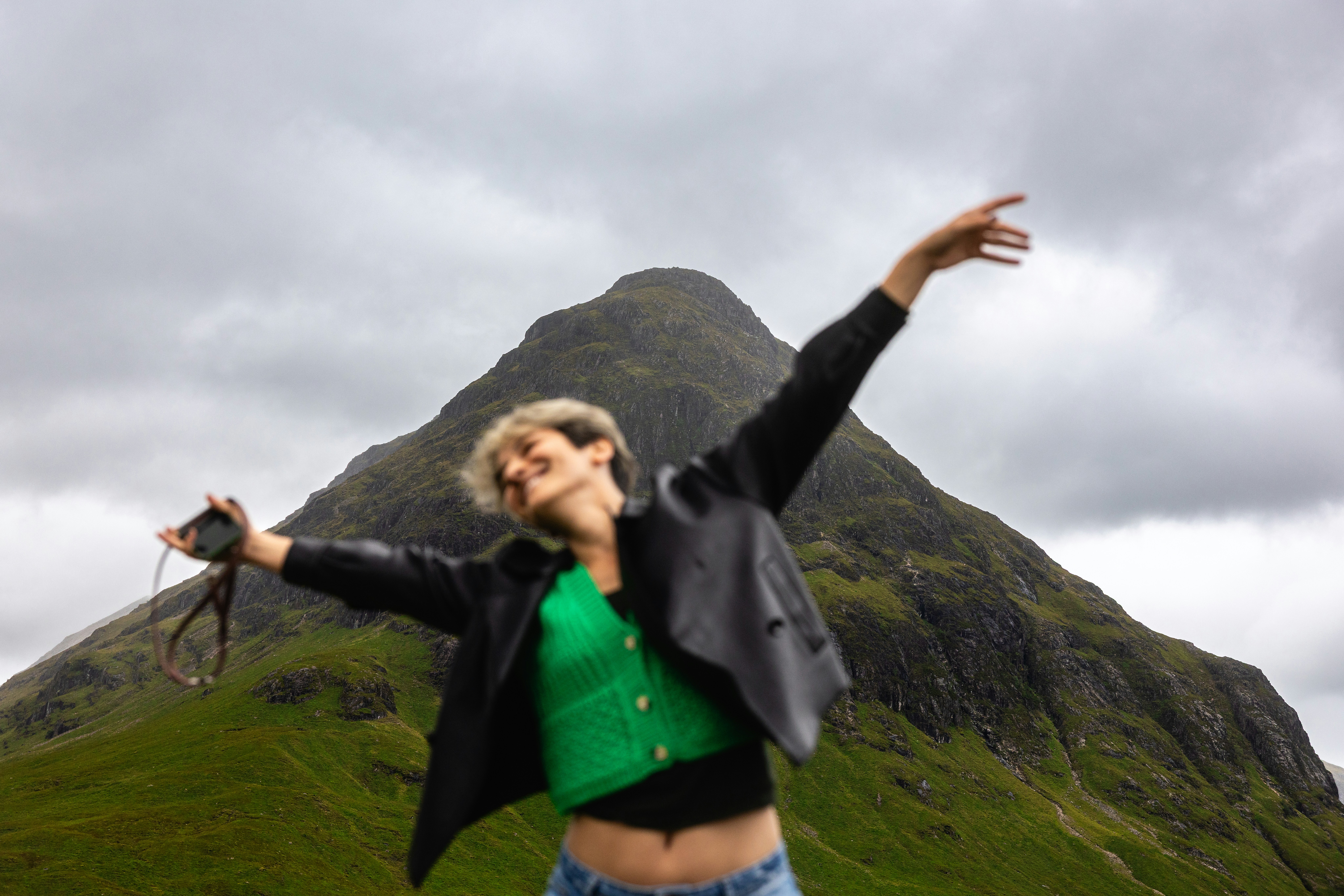 Mountain Reverie: A Blurred Moment with a GreenTop Front and Open Sky