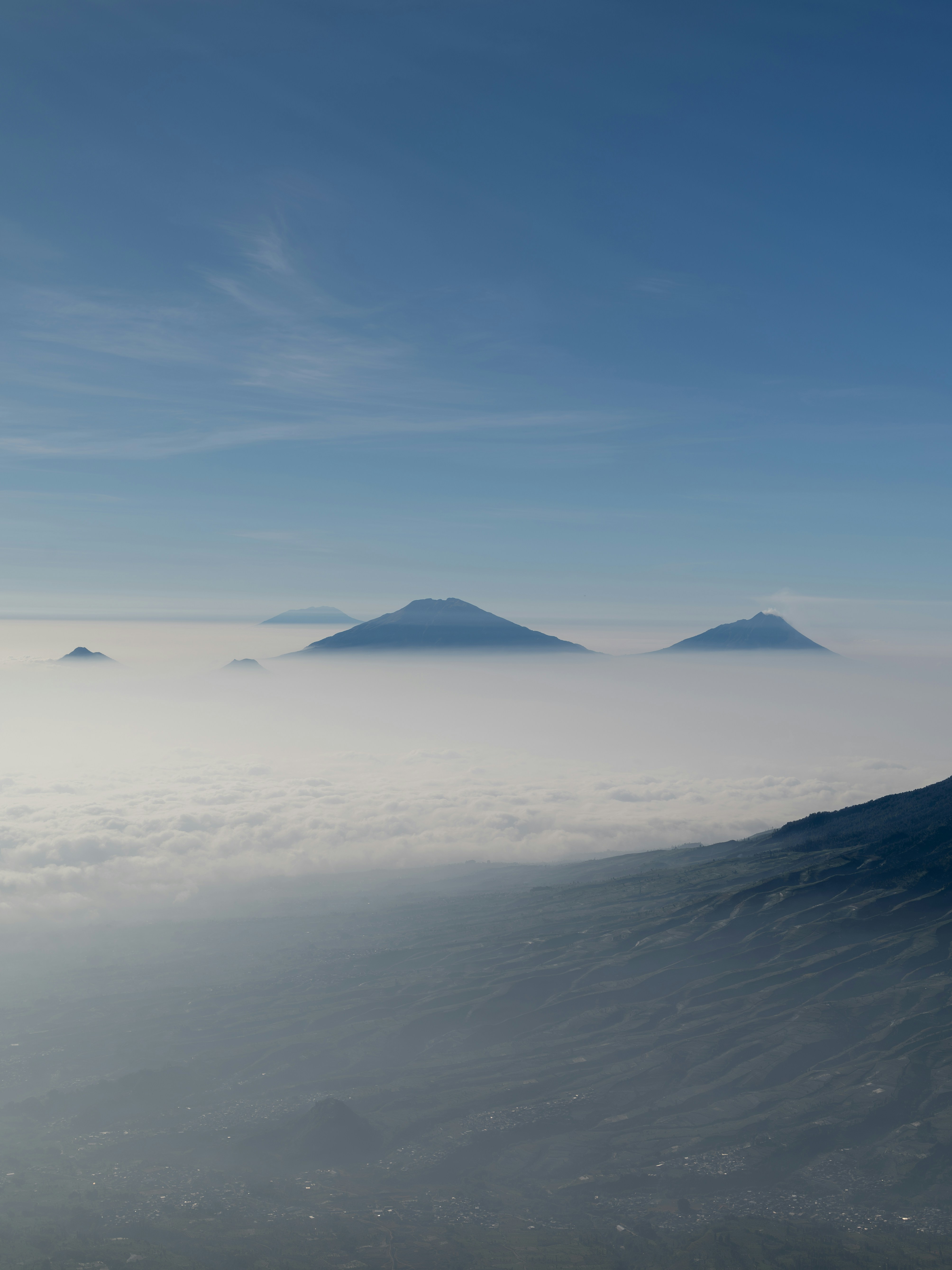 Misty Peaks Above a Quiet Ocean of Clouds