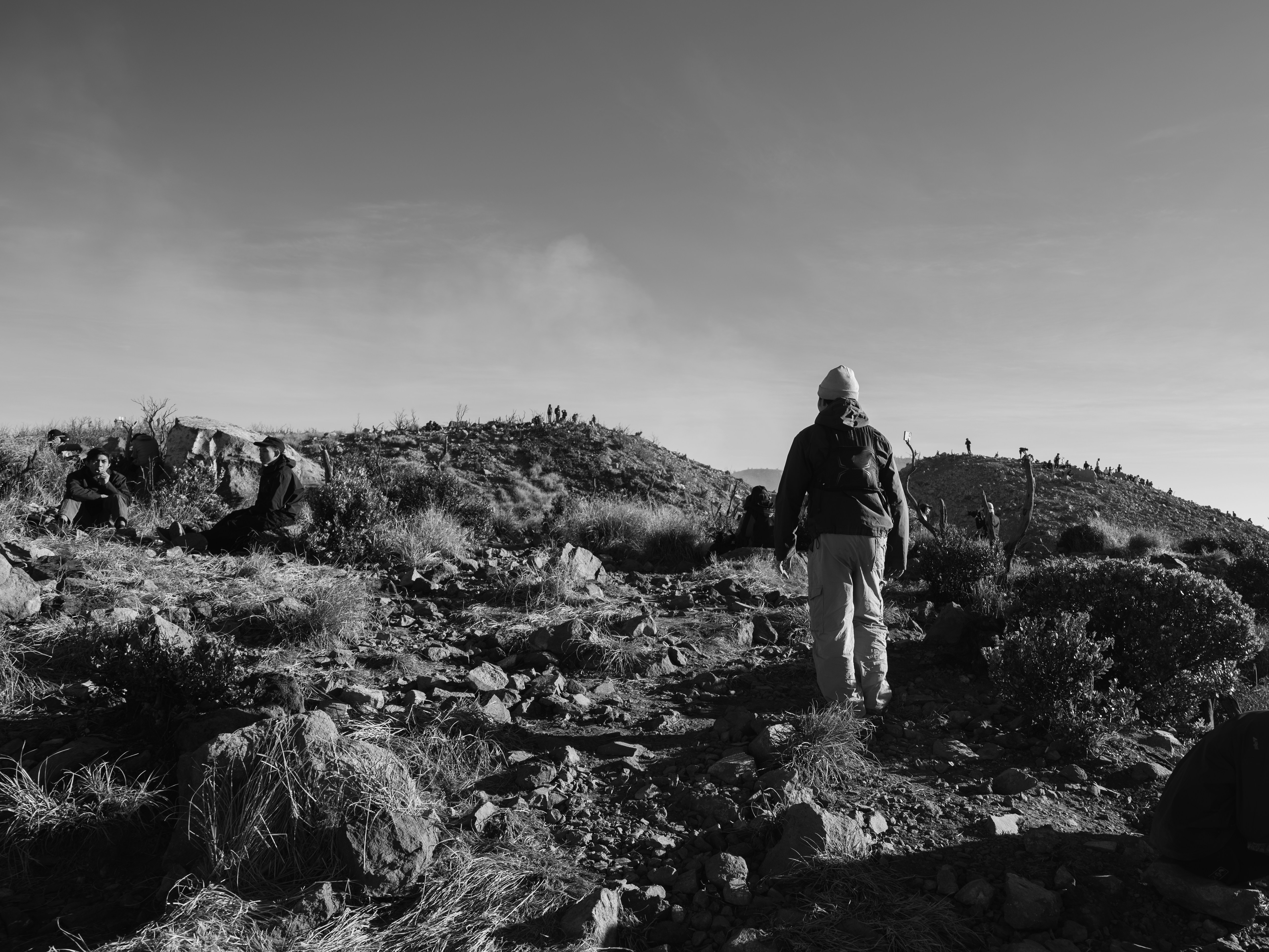 Hikers Ascend the Windswept Ridge
