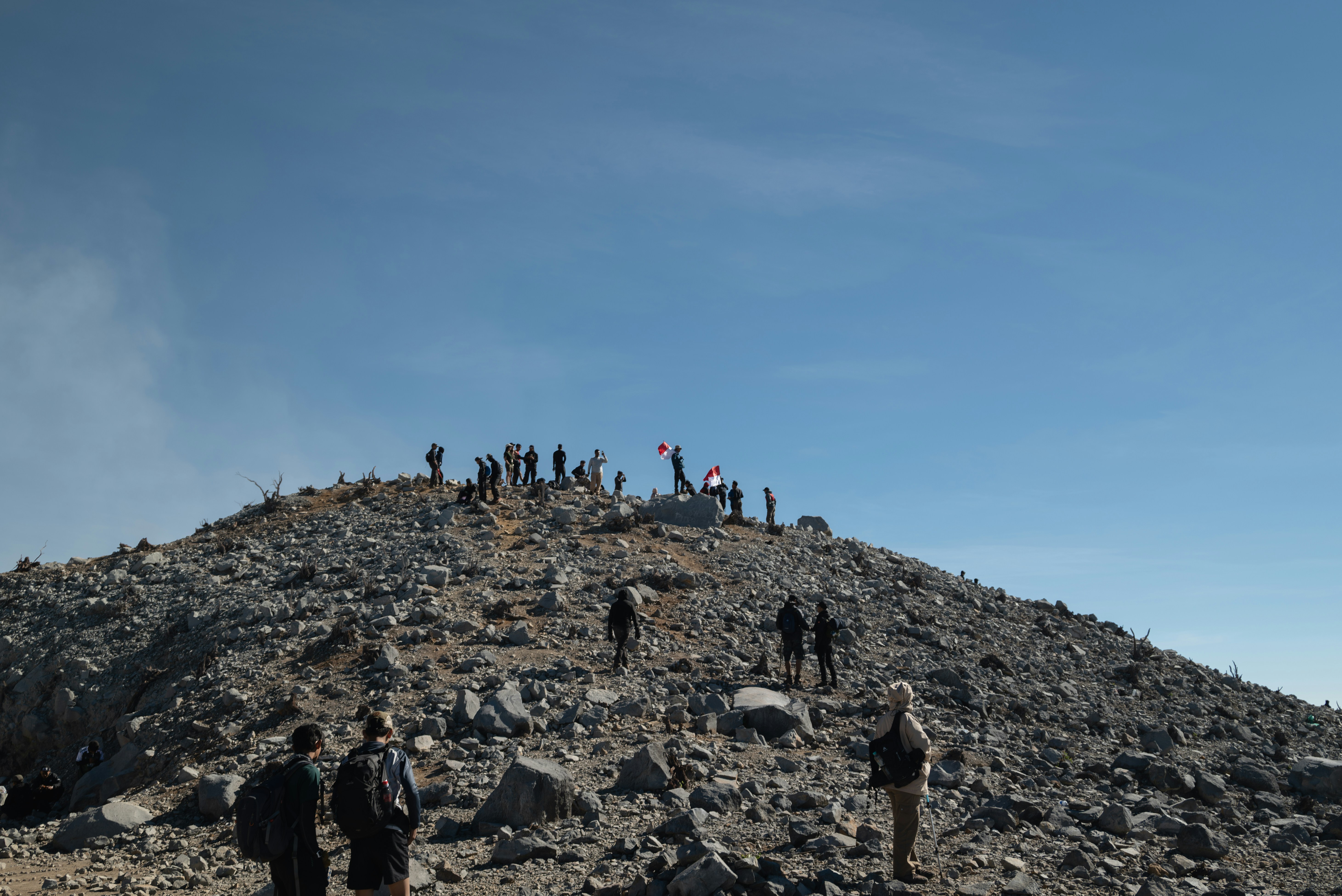 Summit Gathering on a Rugged Slope