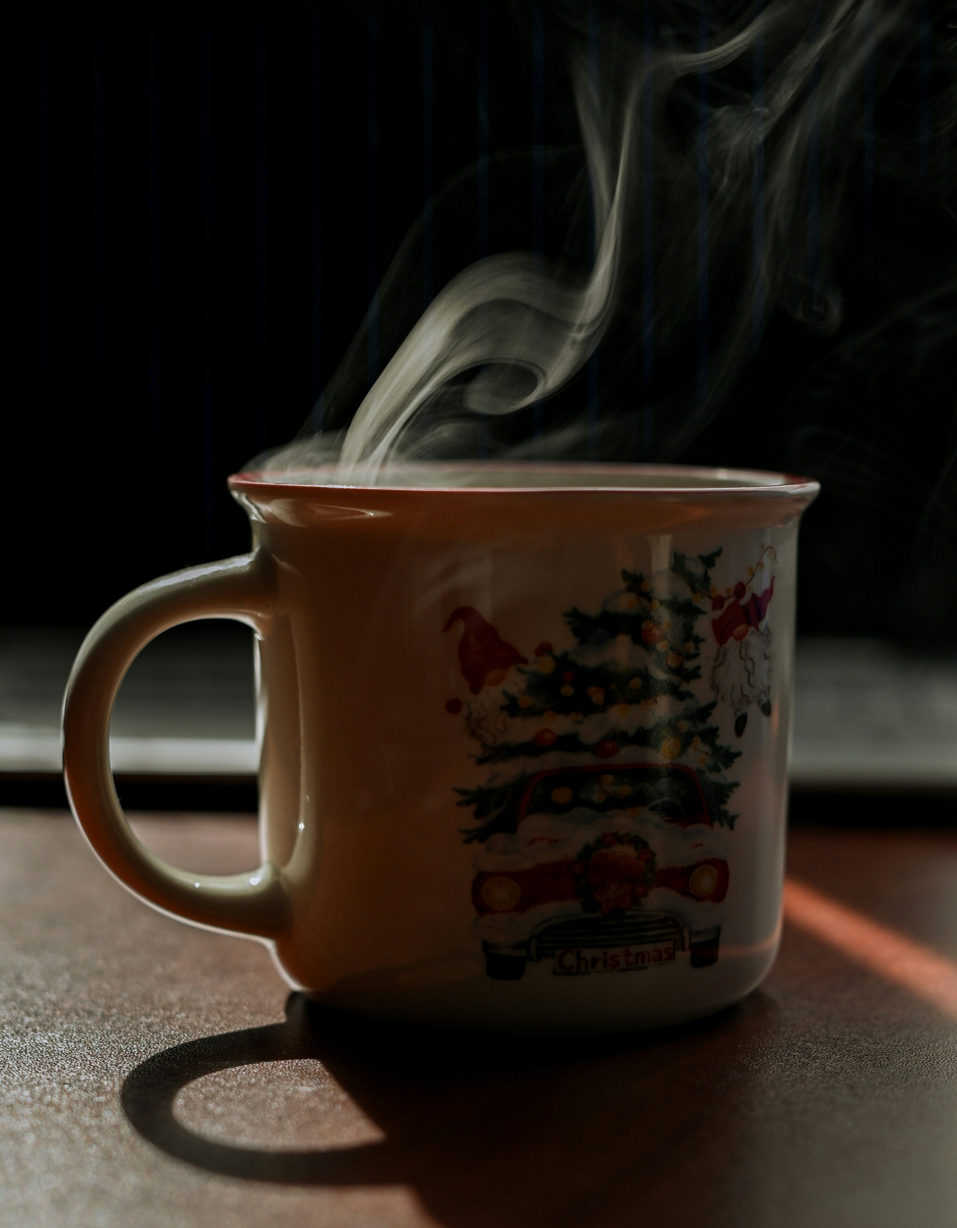 Steaming Christmas: A Ceramic Mug in Gentle Spotlight
