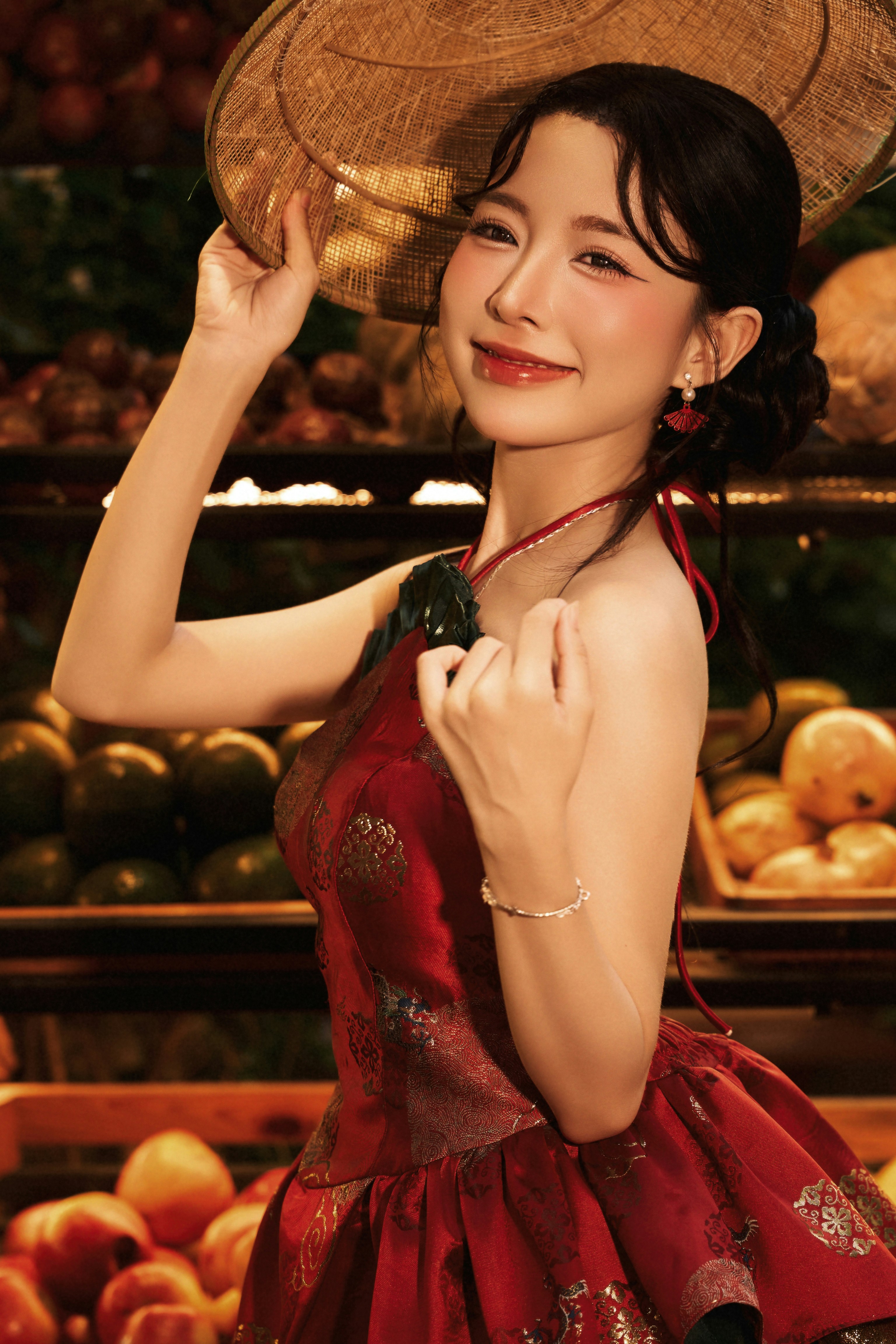 Portrait in a Market Glow: A Red-Leaf Ballgown Under a Straw Hat