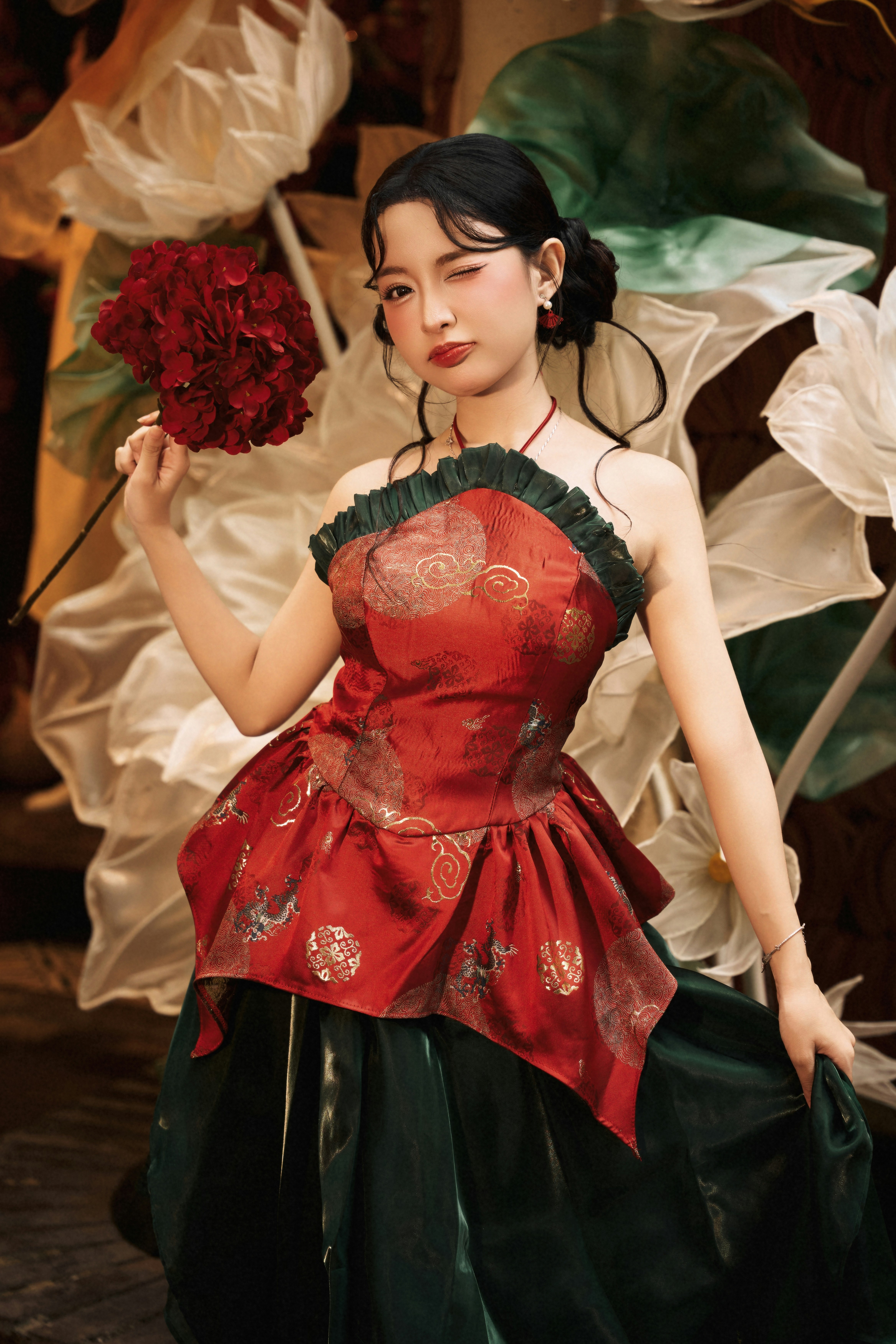 Crimson Silk and Contemplation: A Dancer in Velvet Green