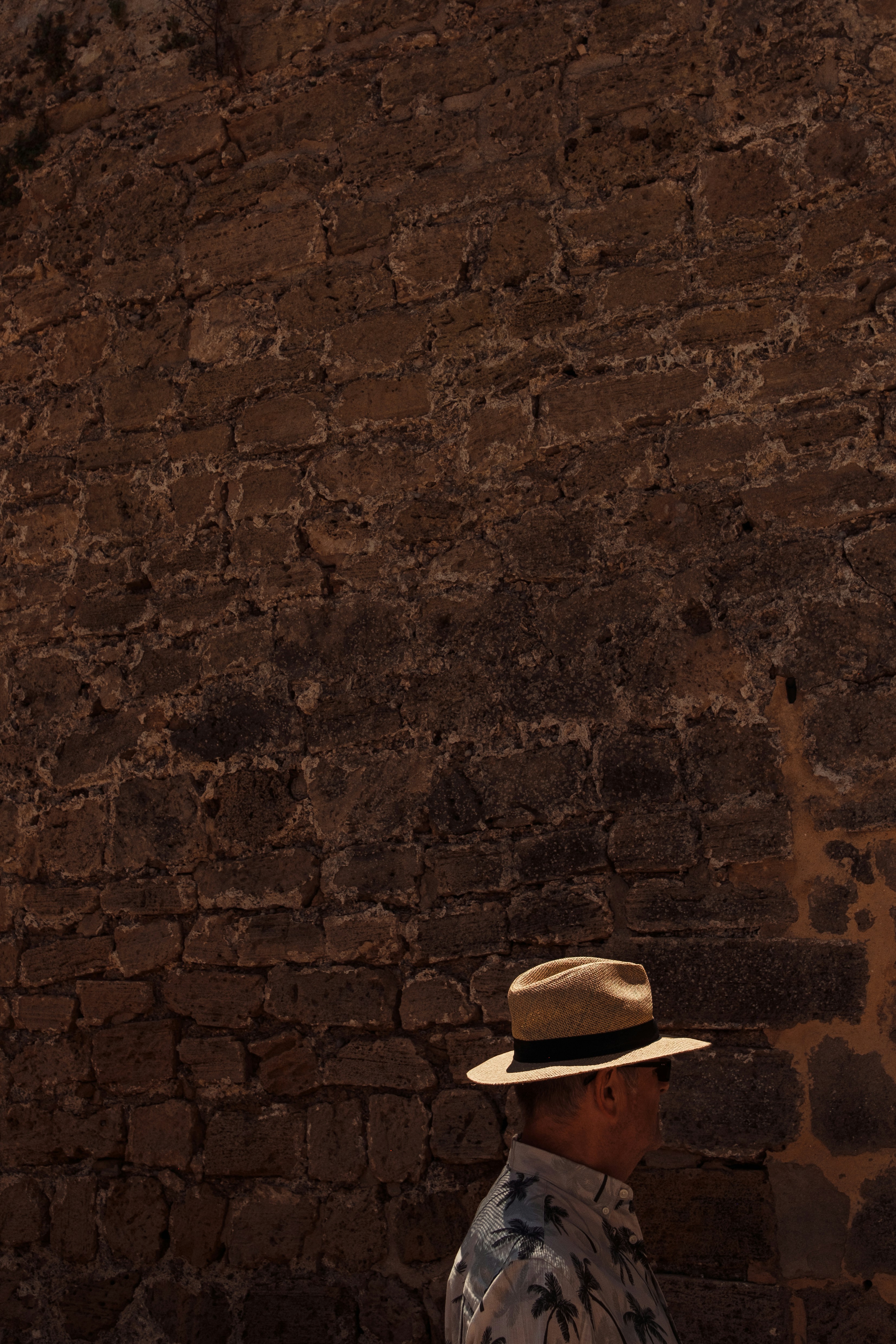 Sunlit Seeker in the Stone Corridor