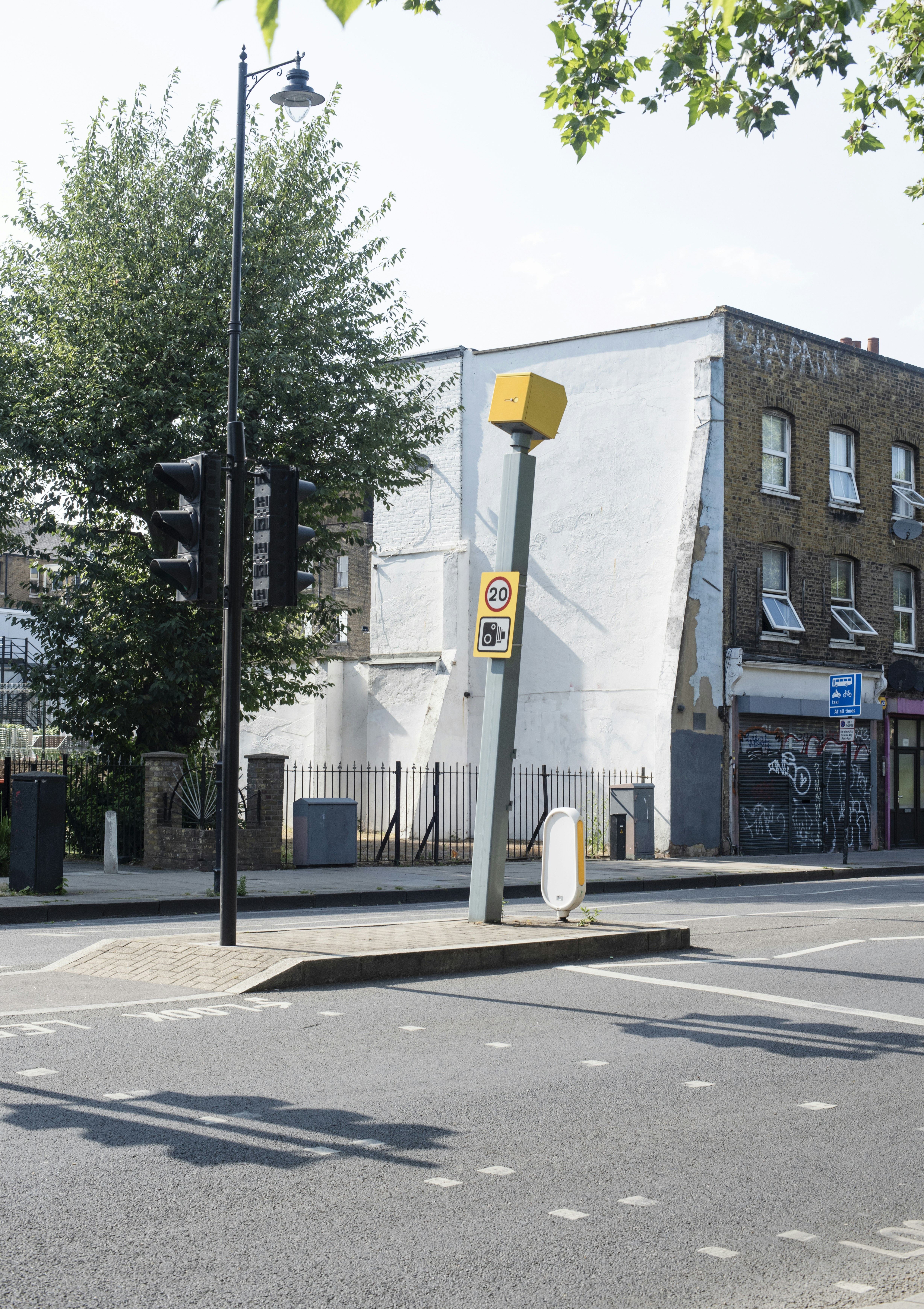 Street Corner with Tilted Post and Graffiti-Patterned Wall
